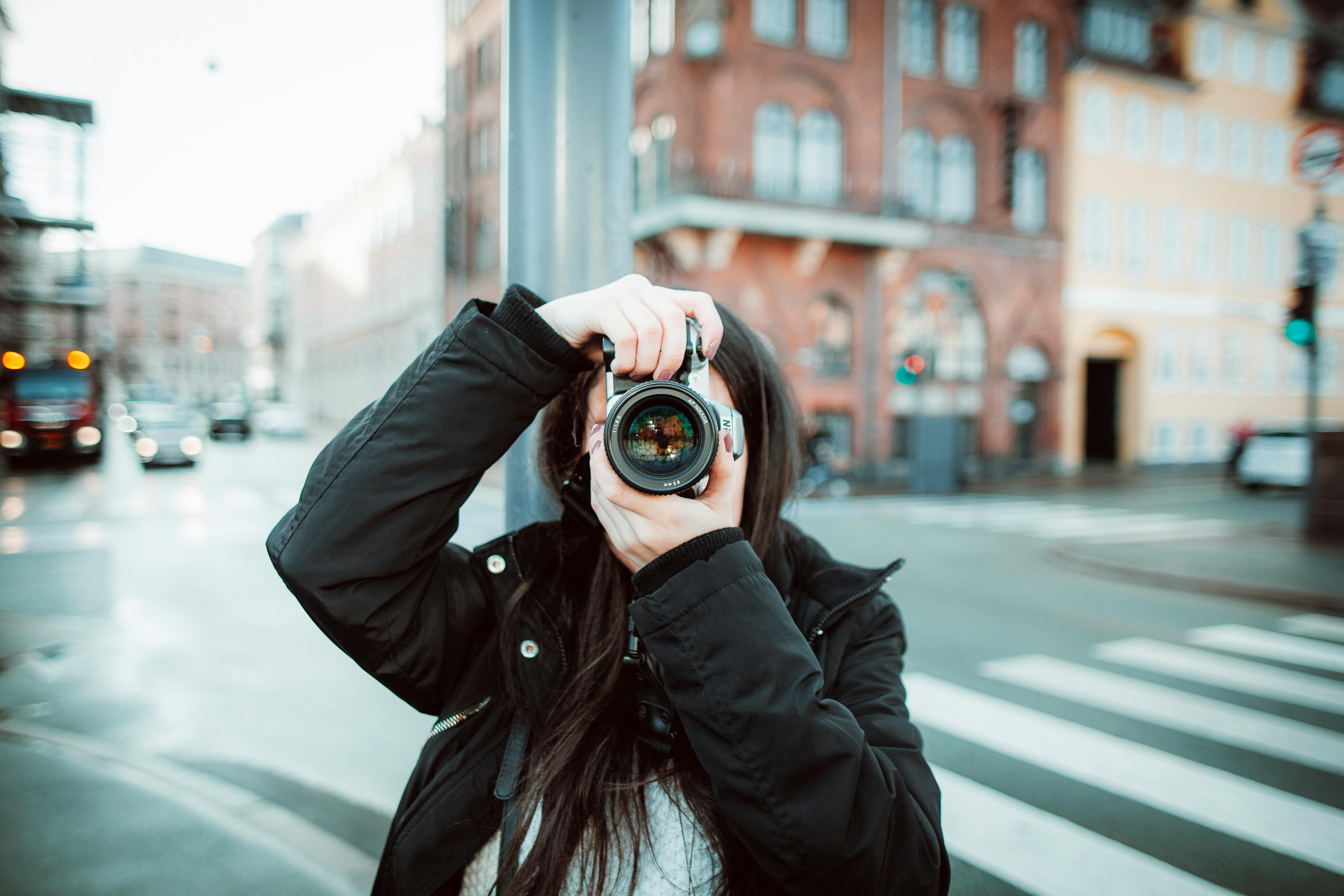 Woman Photographing in City · Free Stock Photo
