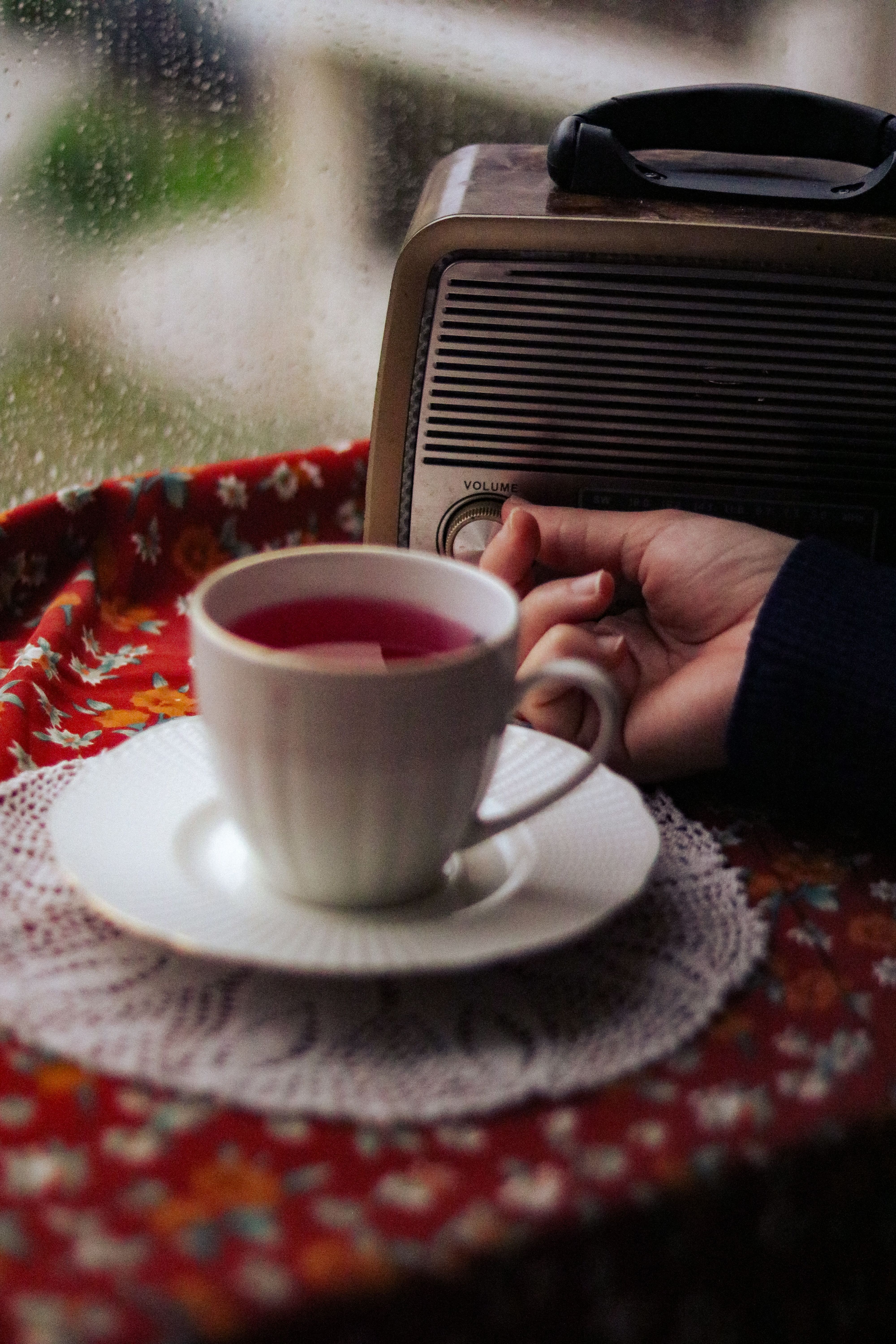 Woman Hand over Vintage Radio and Cup of Tea · Free Stock Photo