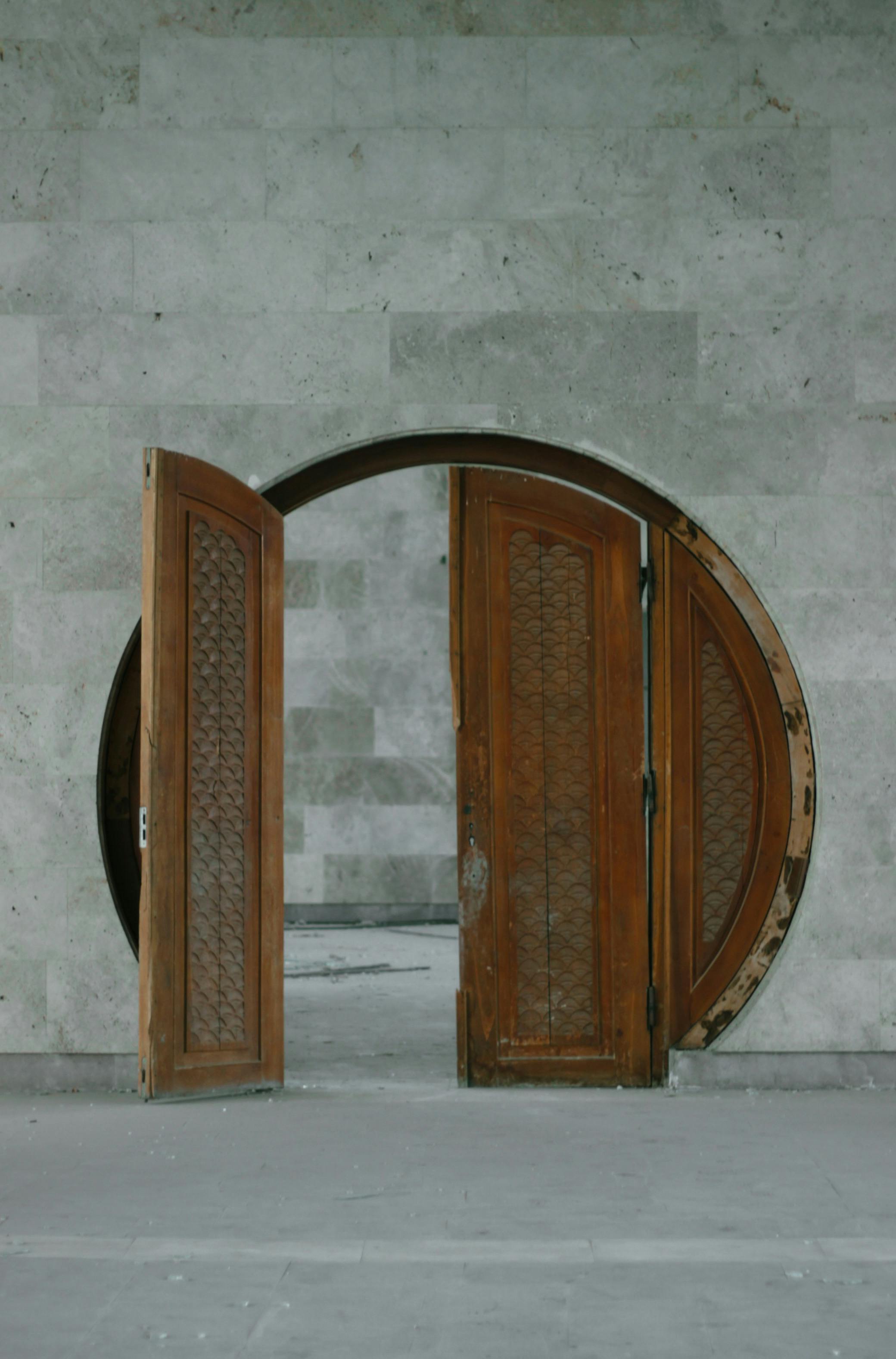 Open, Circular Door in Stone Wall · Free Stock Photo