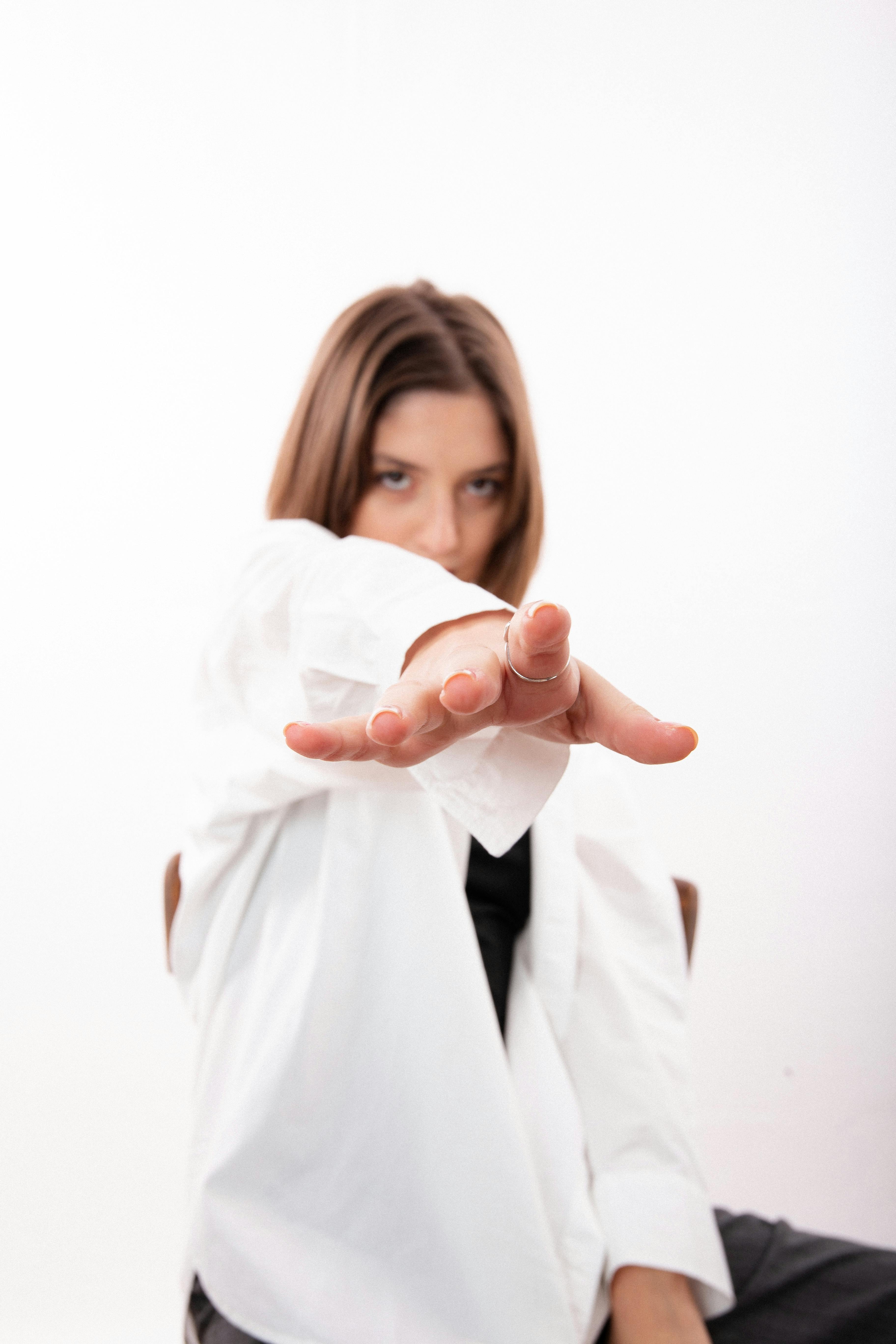 A Woman Sticking Out her Hand · Free Stock Photo