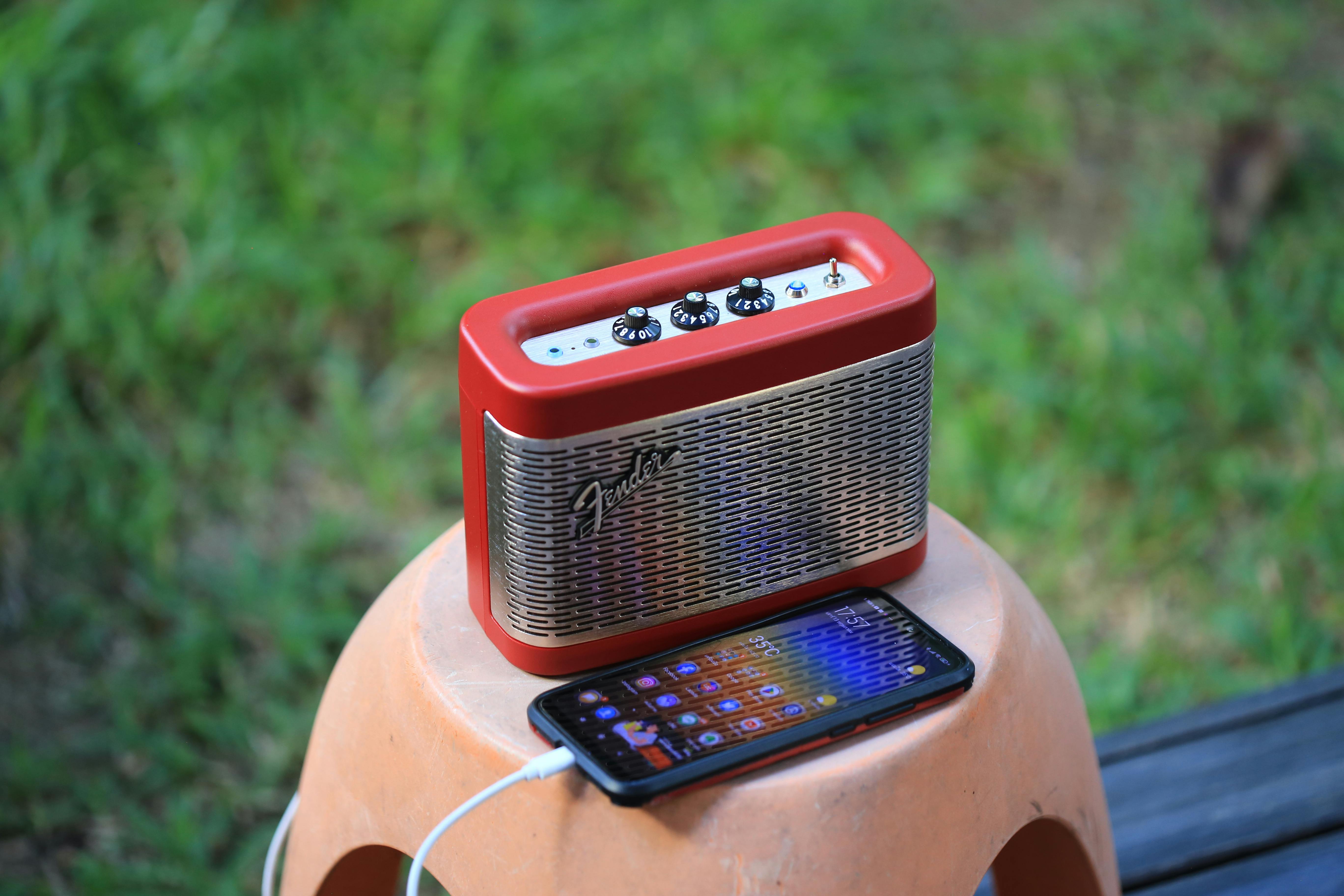 Modern Cellphone and Speaker on Stool in Nature · Free Stock Photo