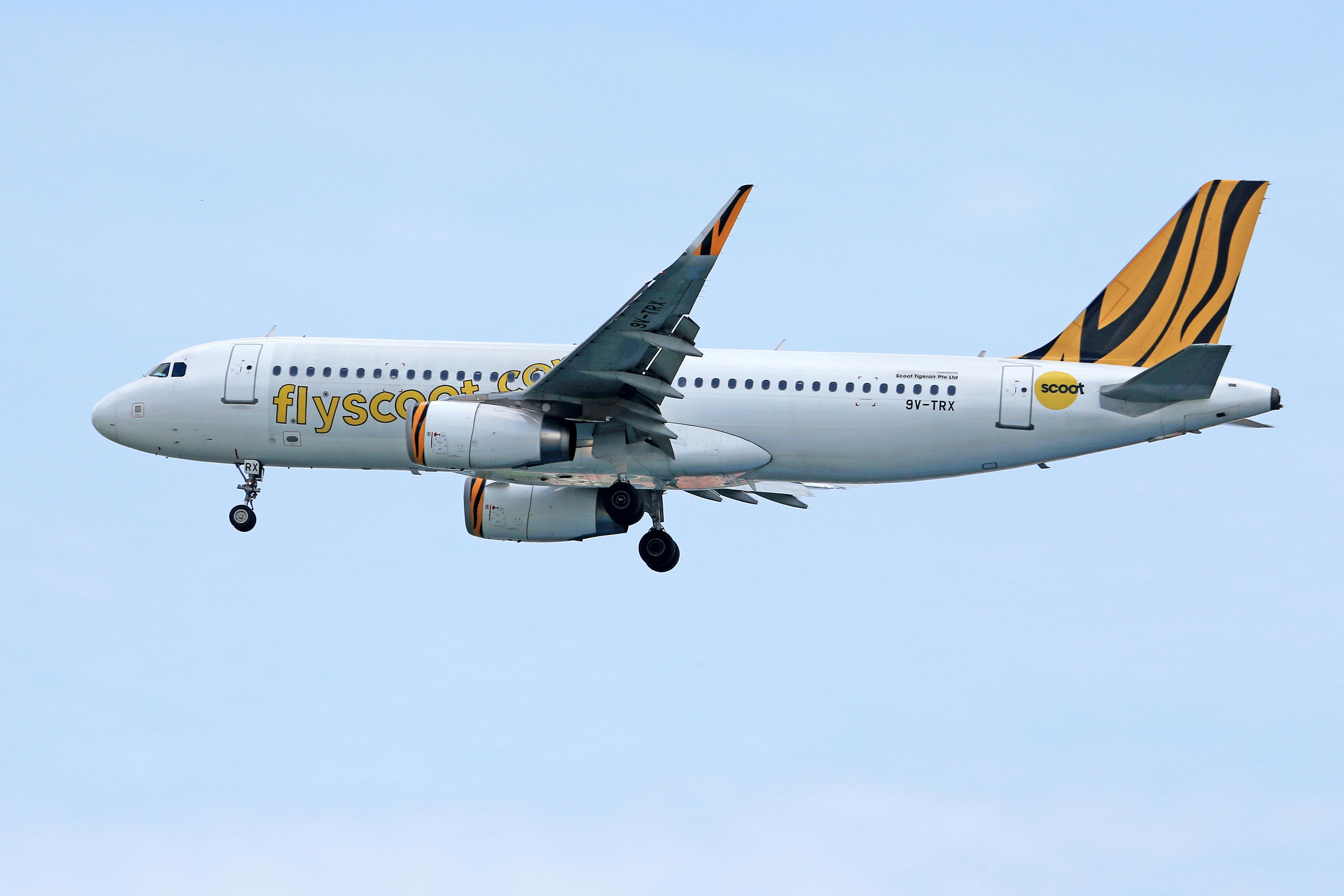 9V-TRK Scoot Airlines Airplane Flying against Blue Sky · Free Stock Photo