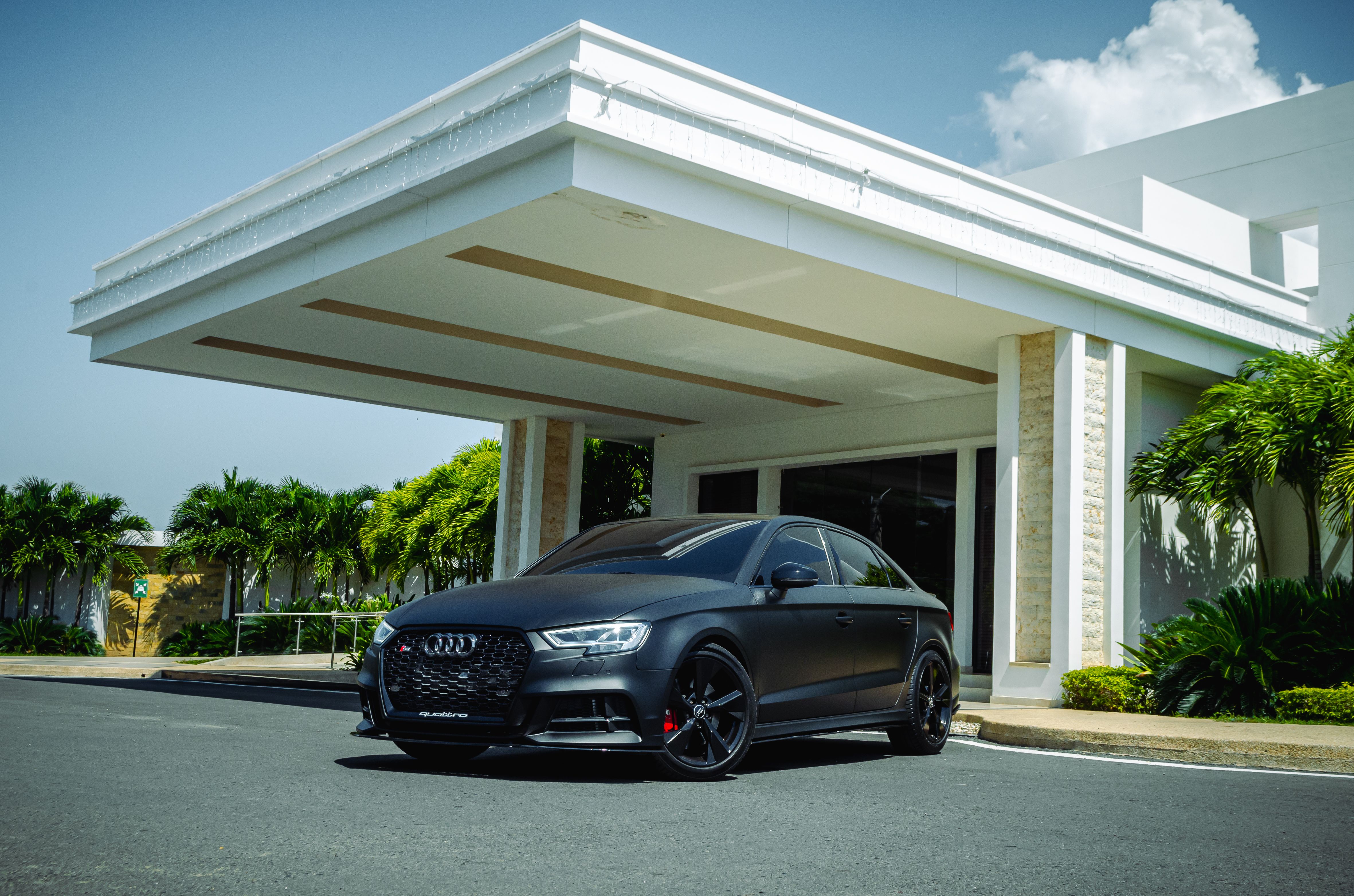 Luxurious Car Parked Outside a Modern White Building · Free Stock Photo