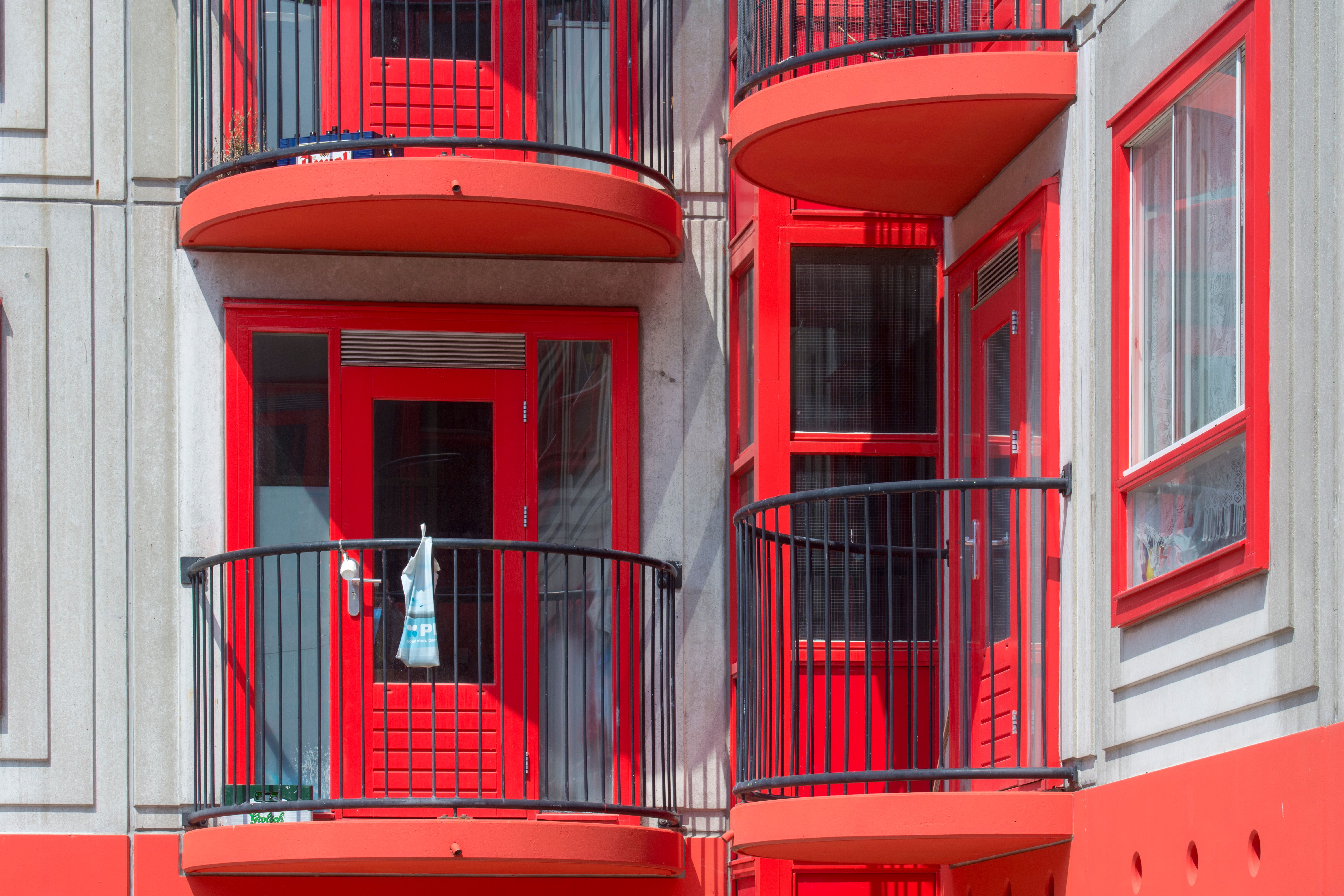 Red Doors on Balconies · Free Stock Photo