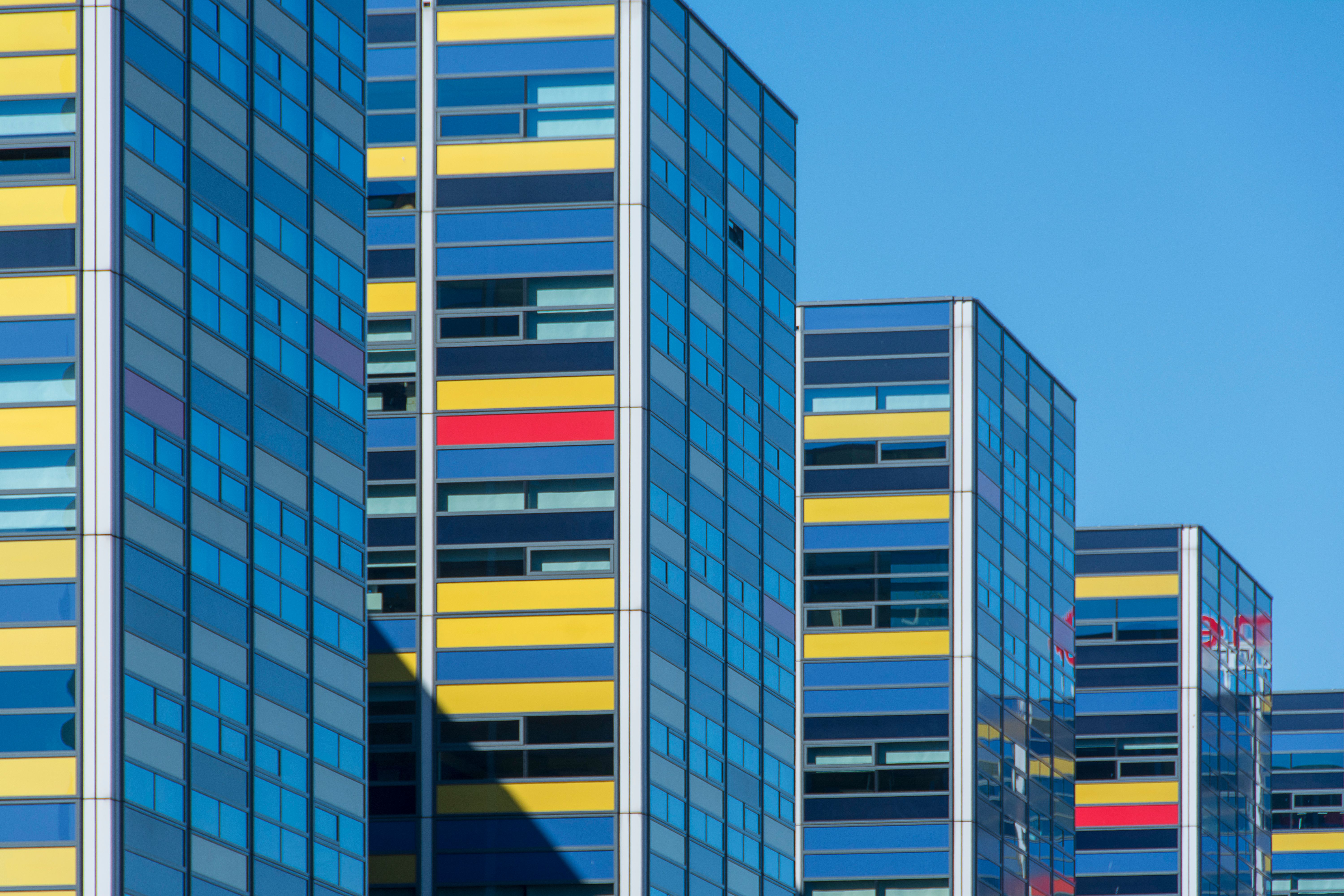 Yellow and Green High-rise Building · Free Stock Photo