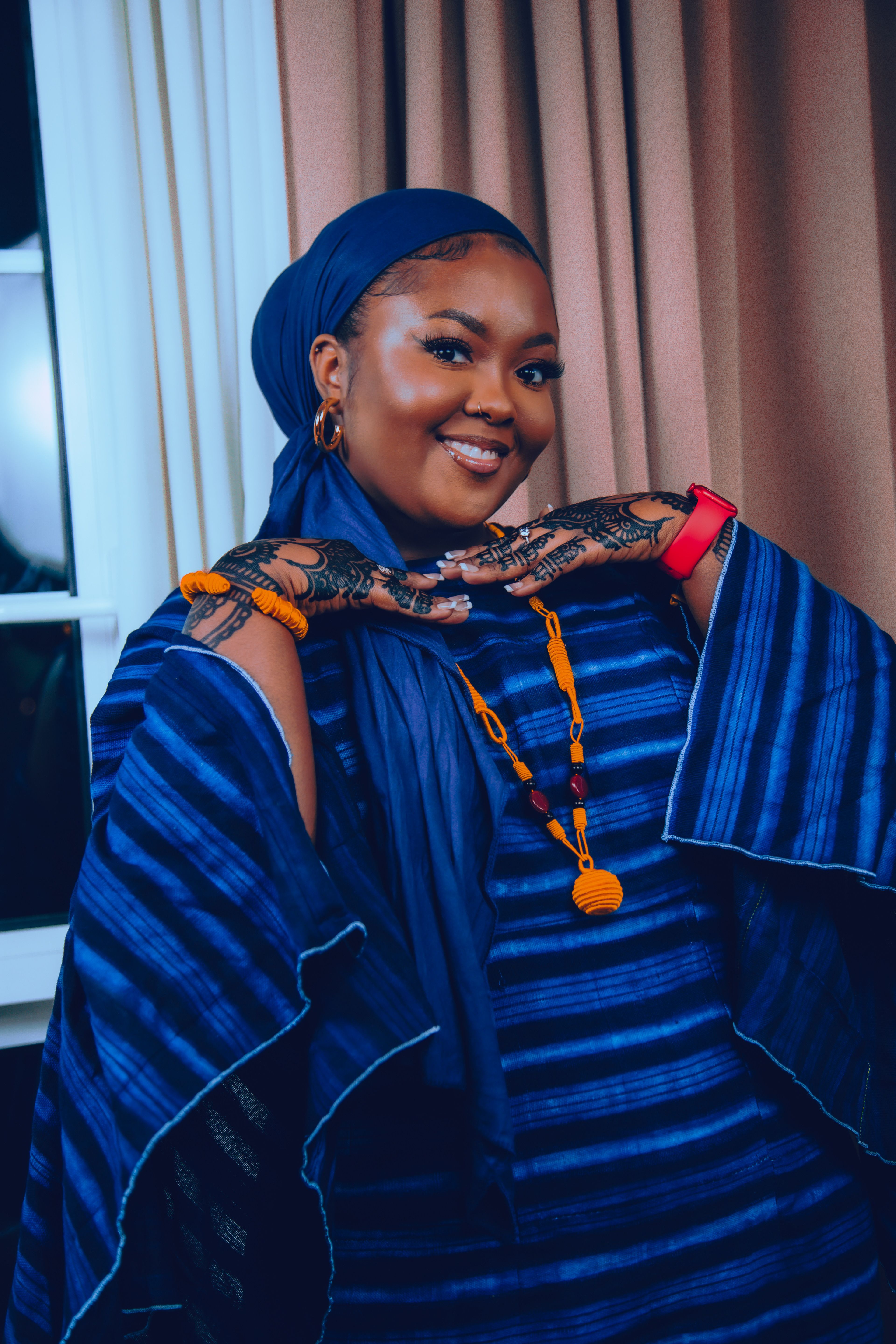 A woman in blue and black clothing posing for a photo · Free Stock Photo