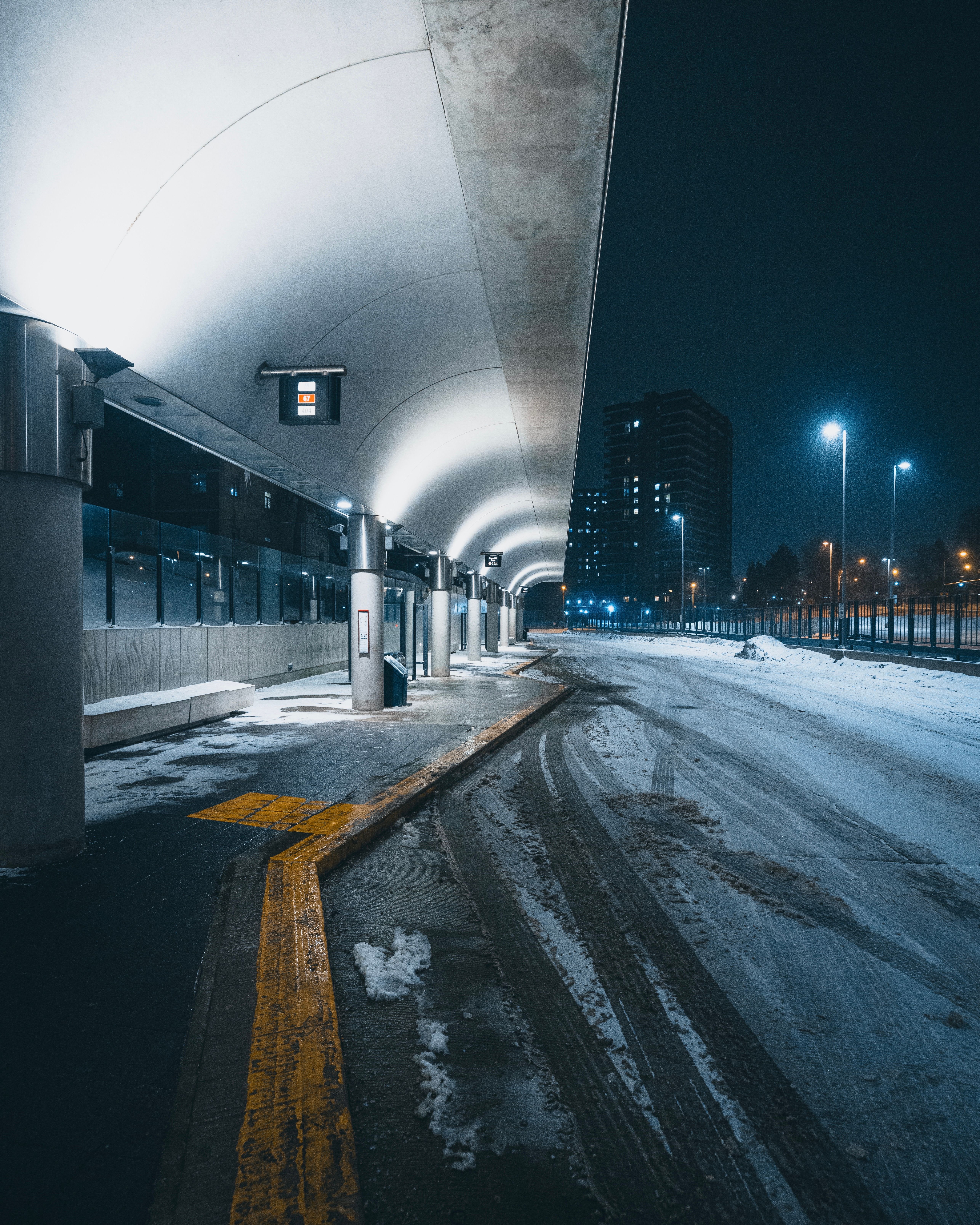 Illuminated Bus Terminal in Winter City · Free Stock Photo