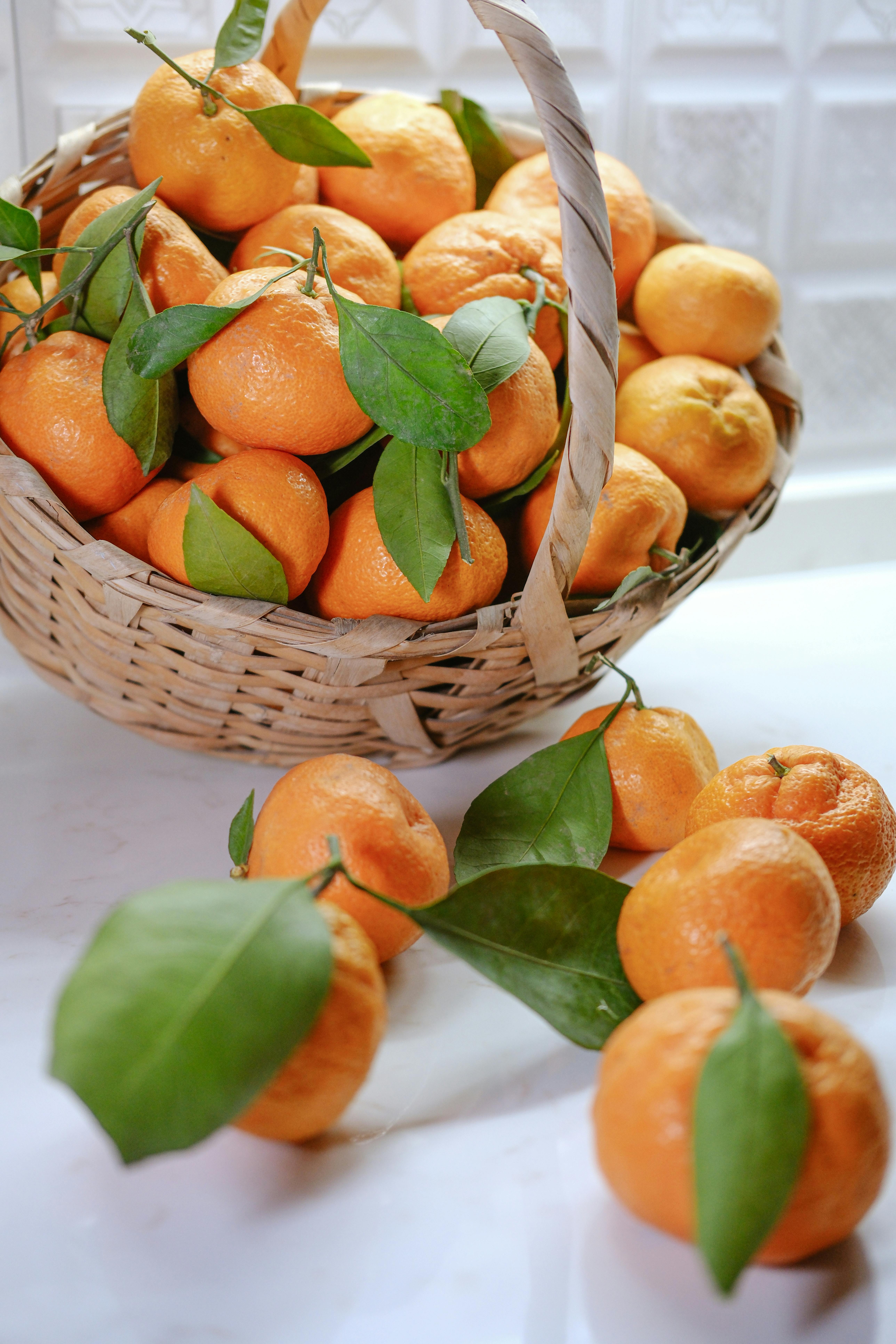 Basket of Tangerines with Leaves · Free Stock Photo