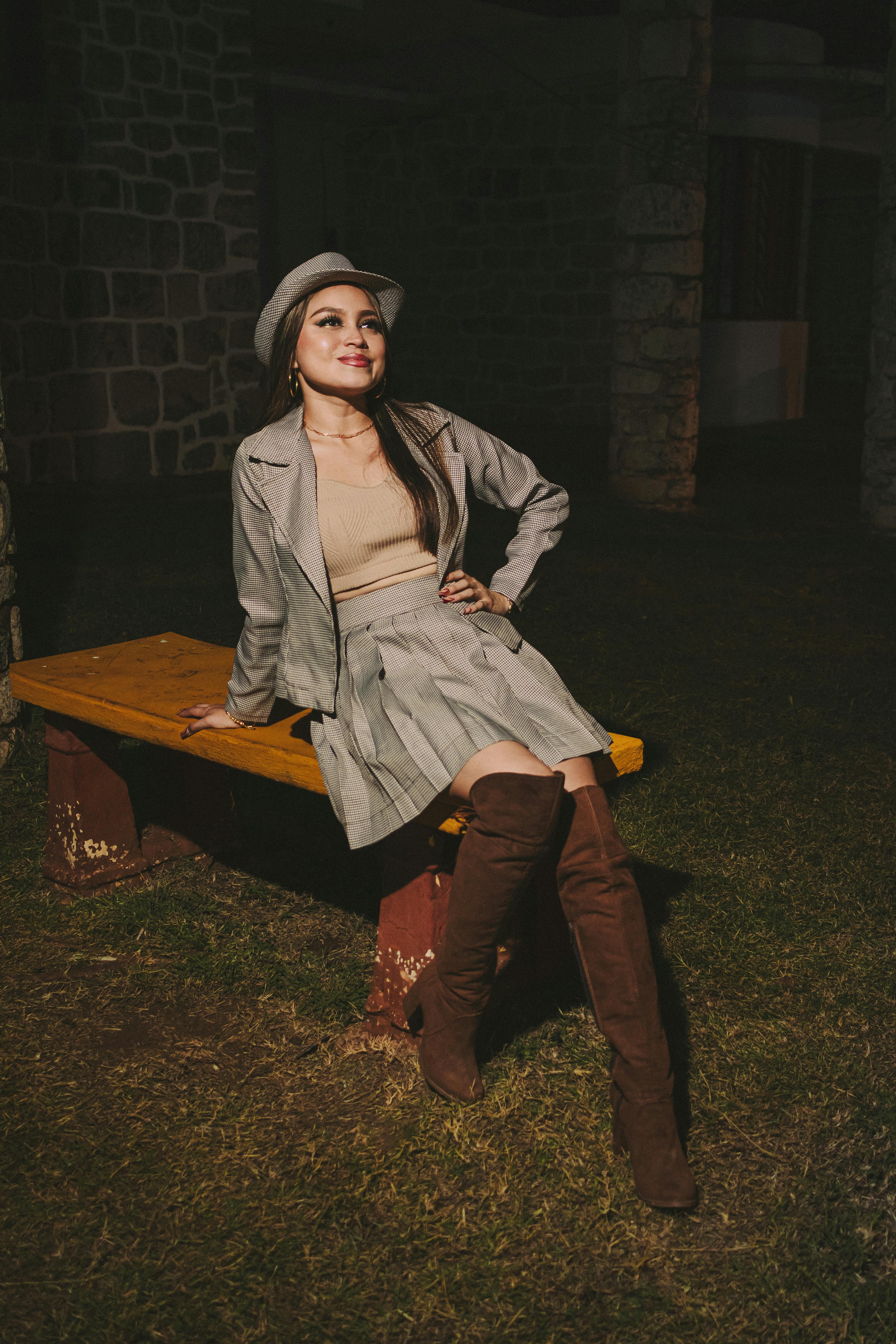 Sitting Woman in Brown Over Knee Boots · Free Stock Photo