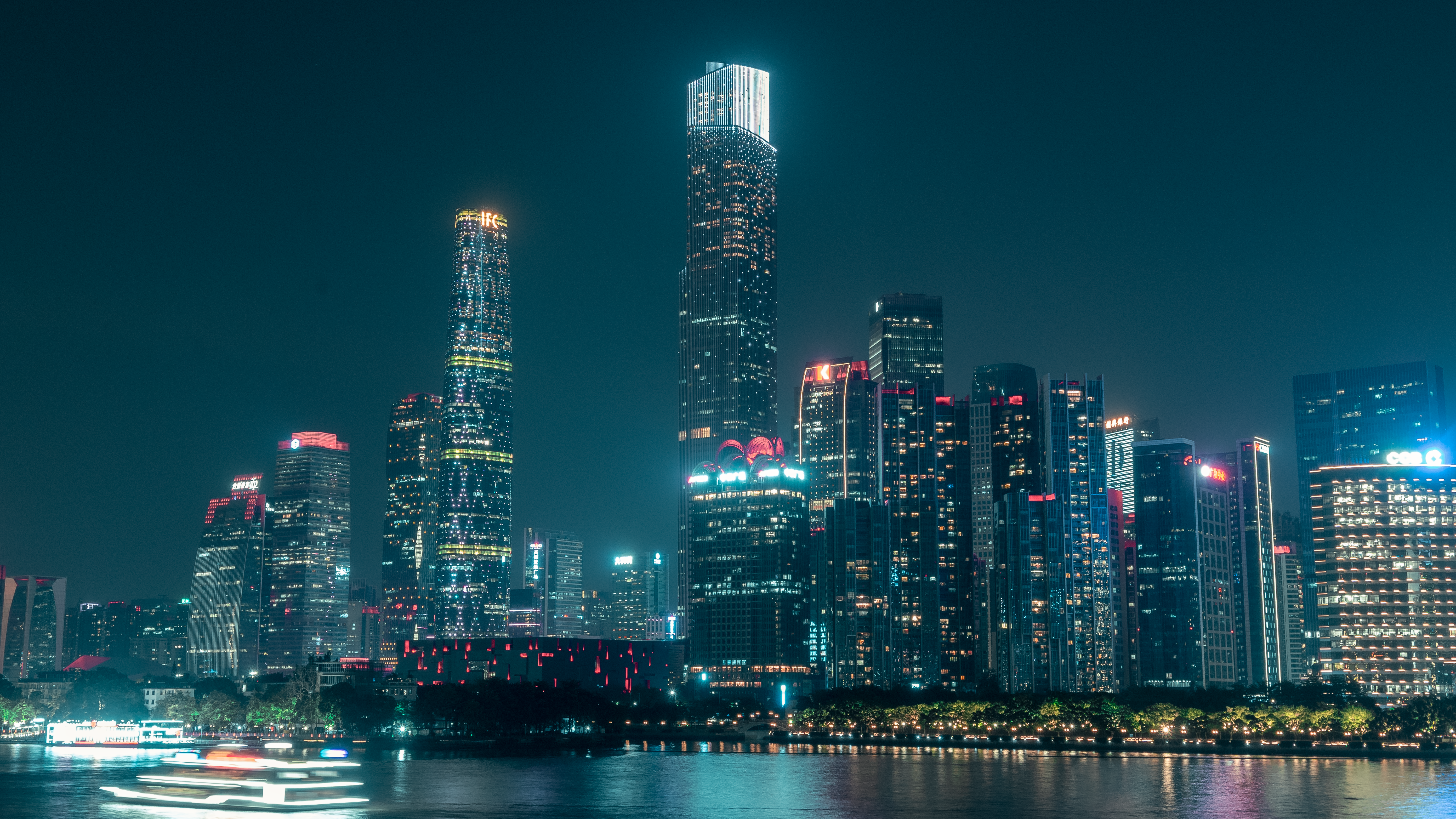 Illuminated Cityscape Against Blue Sky at Night · Free Stock Photo