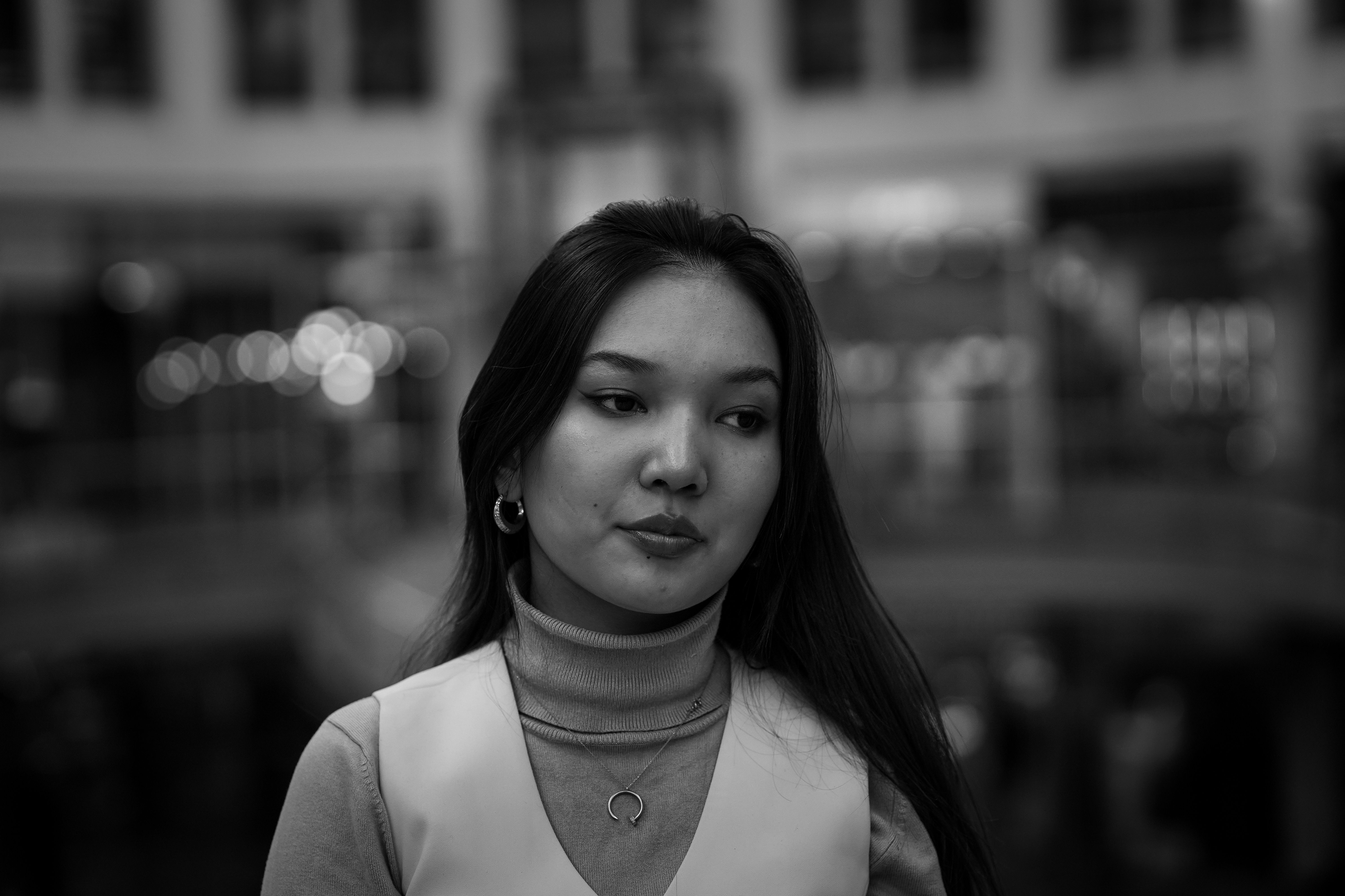 Brunette Woman Wearing a Turtle Neck Sweater and a Vest · Free Stock Photo