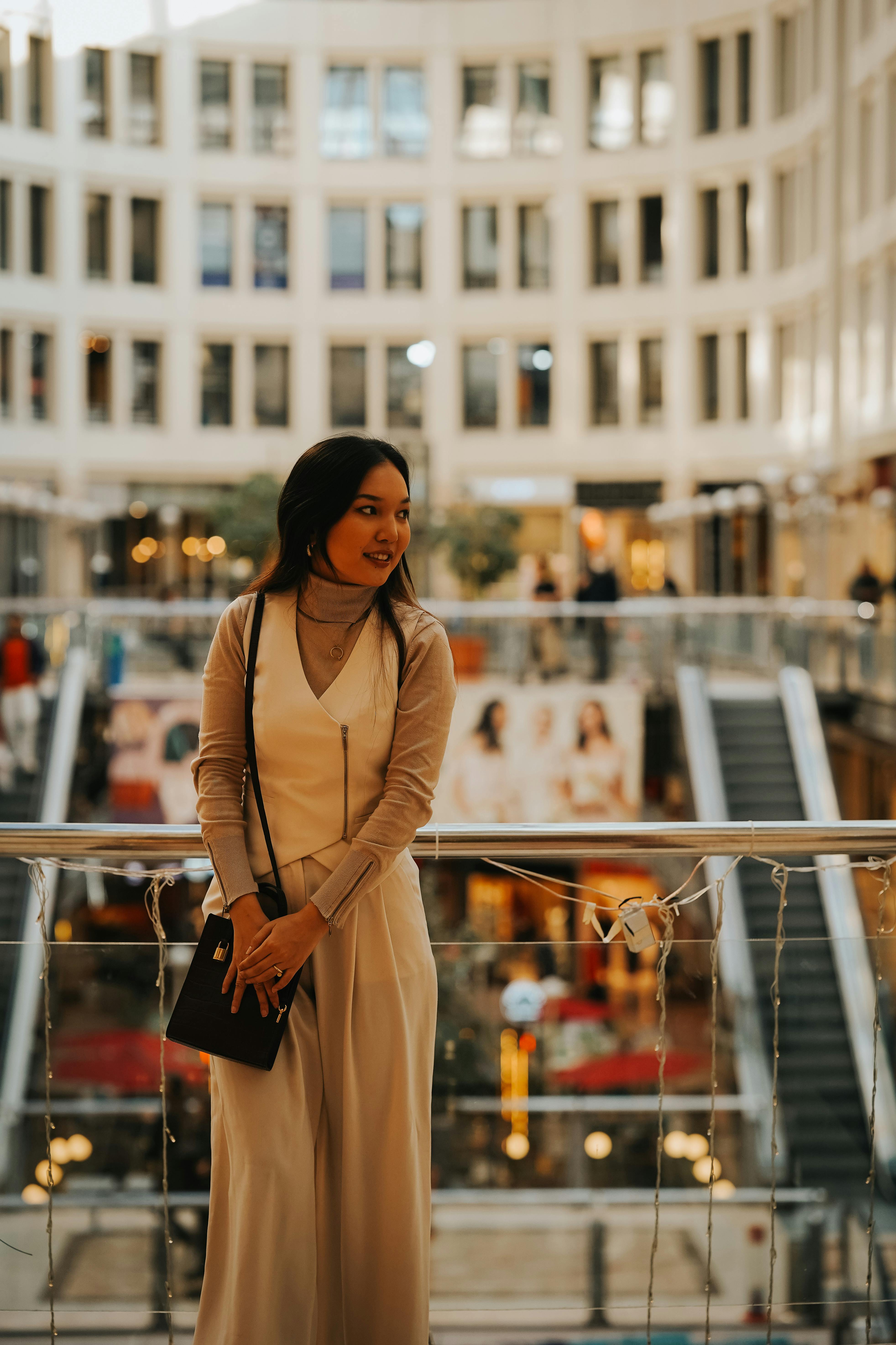 Woman Posing in a Shopping Mall · Free Stock Photo