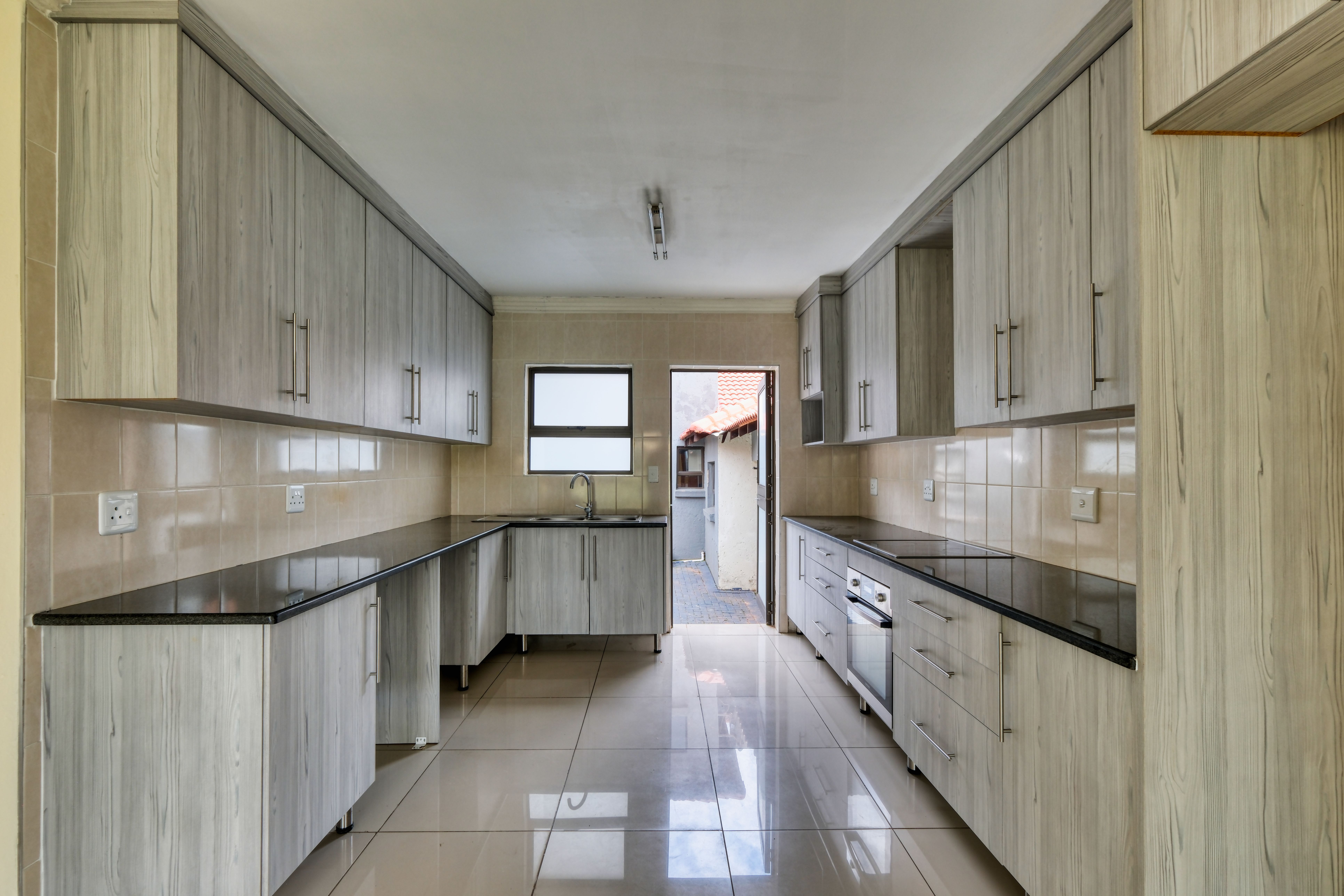 Spacious Kitchen with Wooden Cabinets · Free Stock Photo