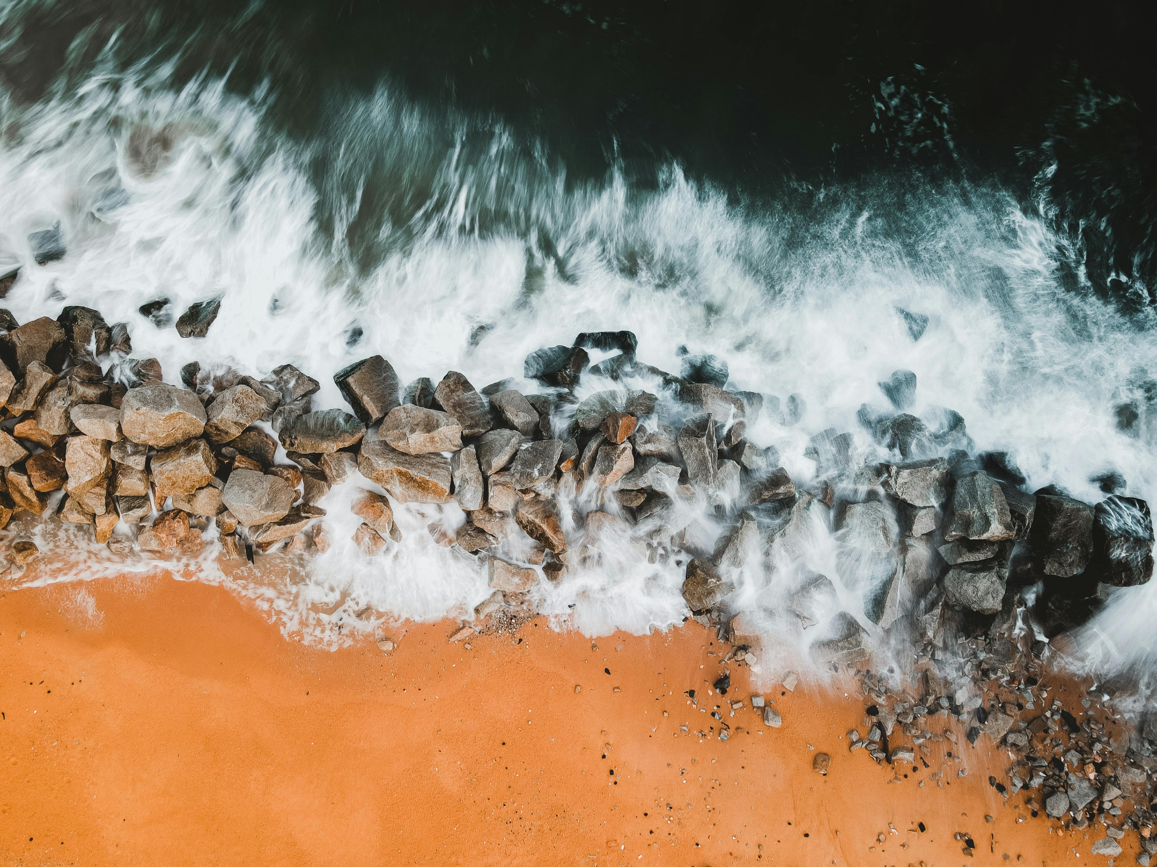 Rock Formation Beside Seashore · Free Stock Photo