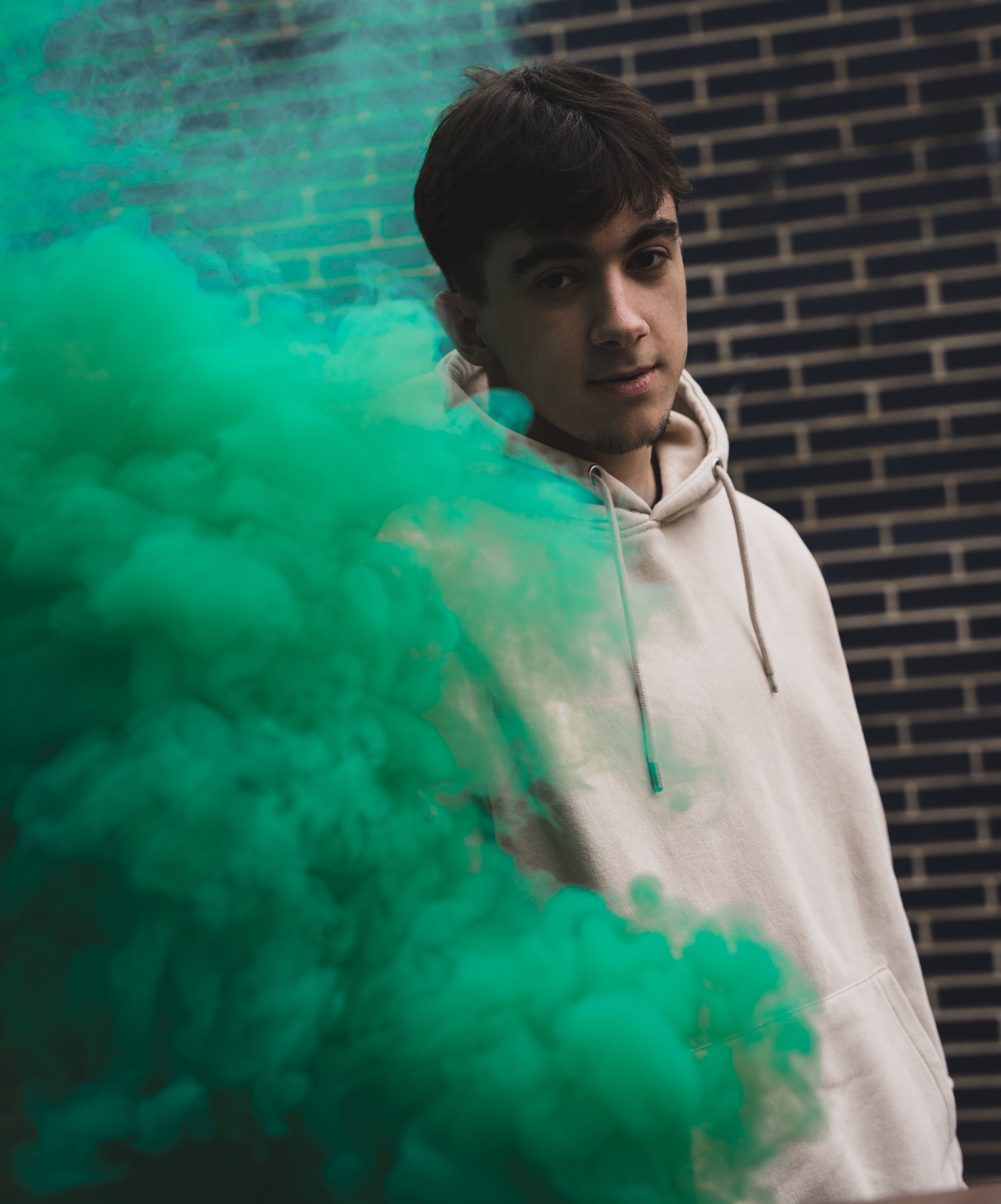 Young Man Among Green Smoke · Free Stock Photo