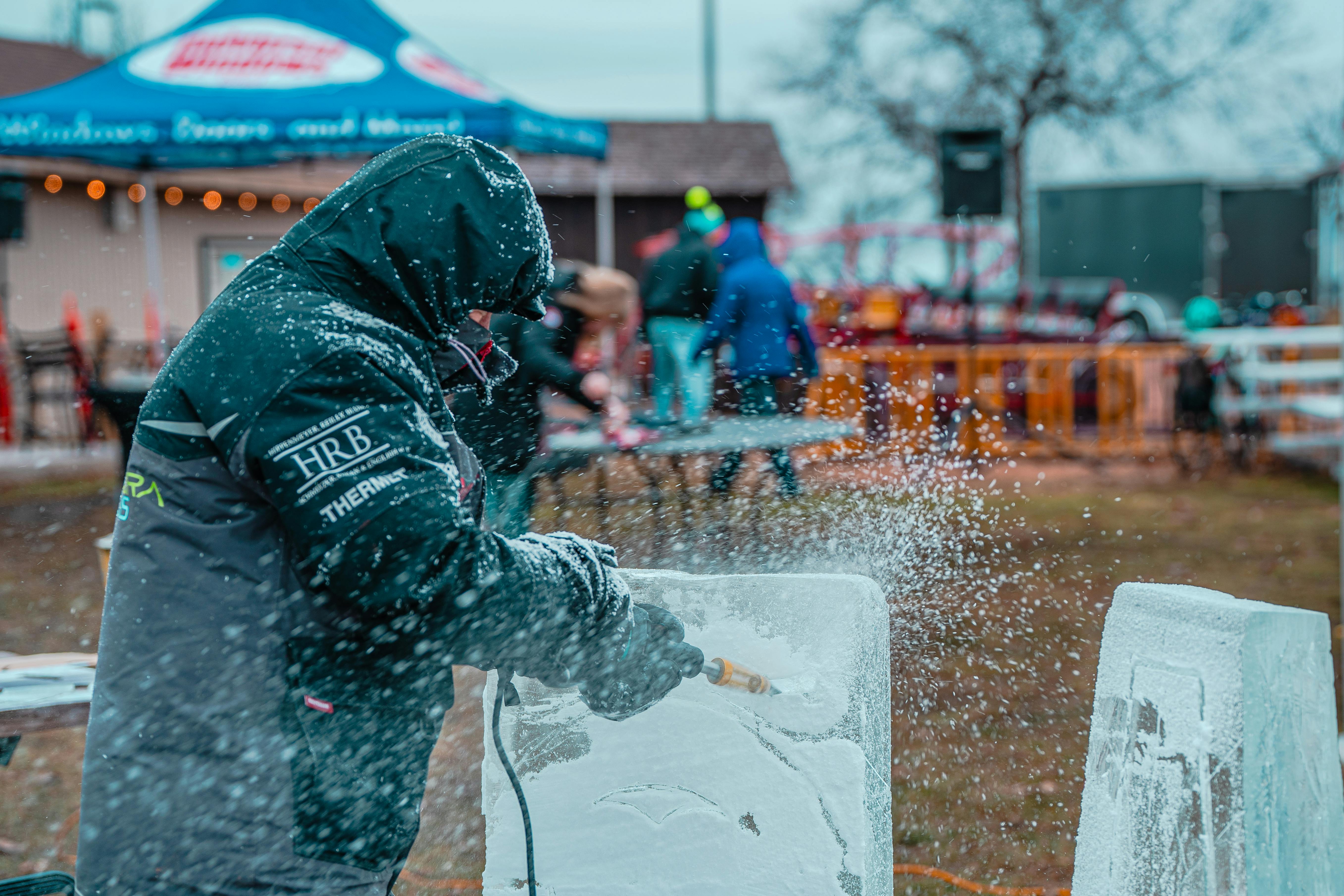 An Artist Sculpting in Ice · Free Stock Photo