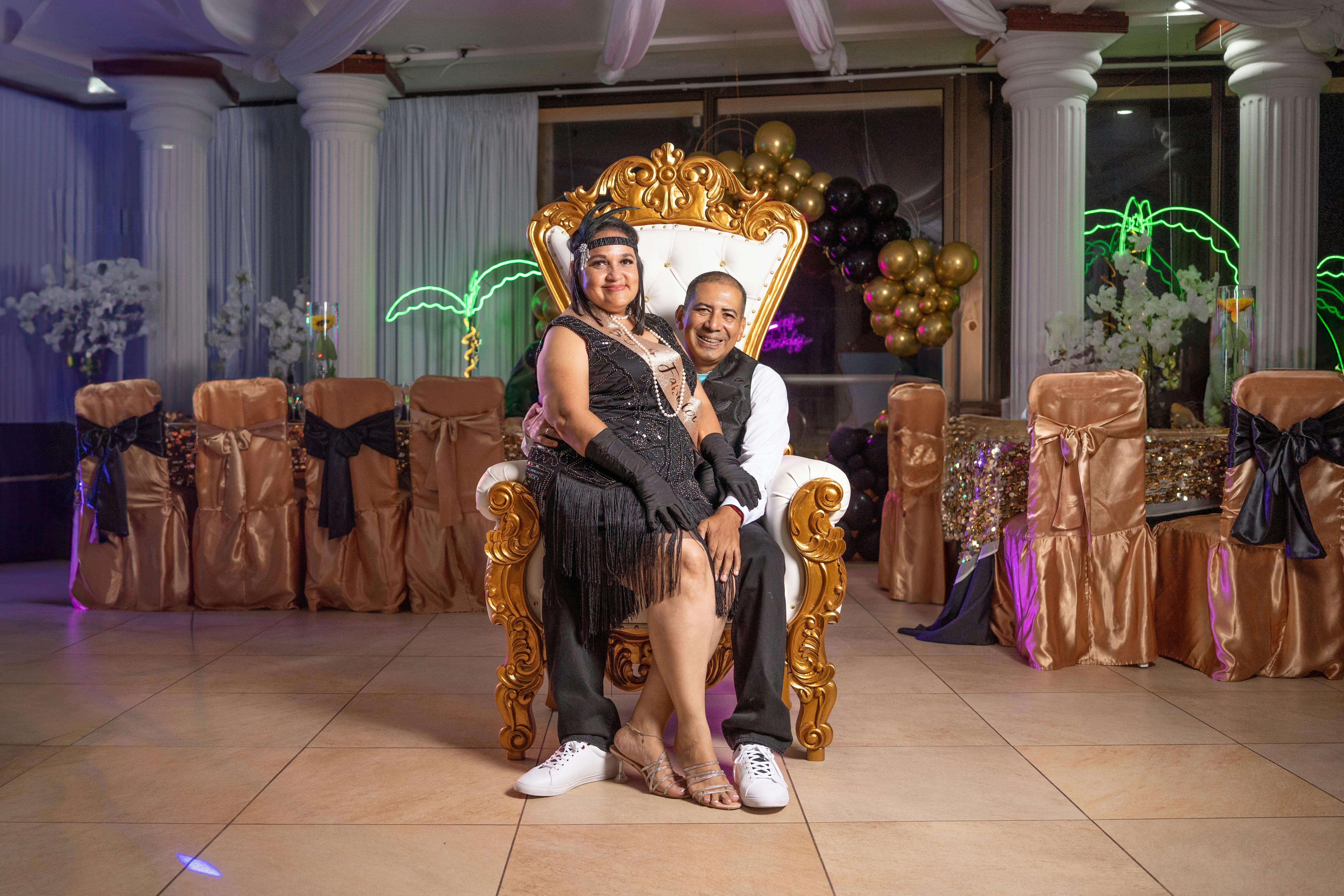 Smiling Newlyweds Sitting on Throne · Free Stock Photo
