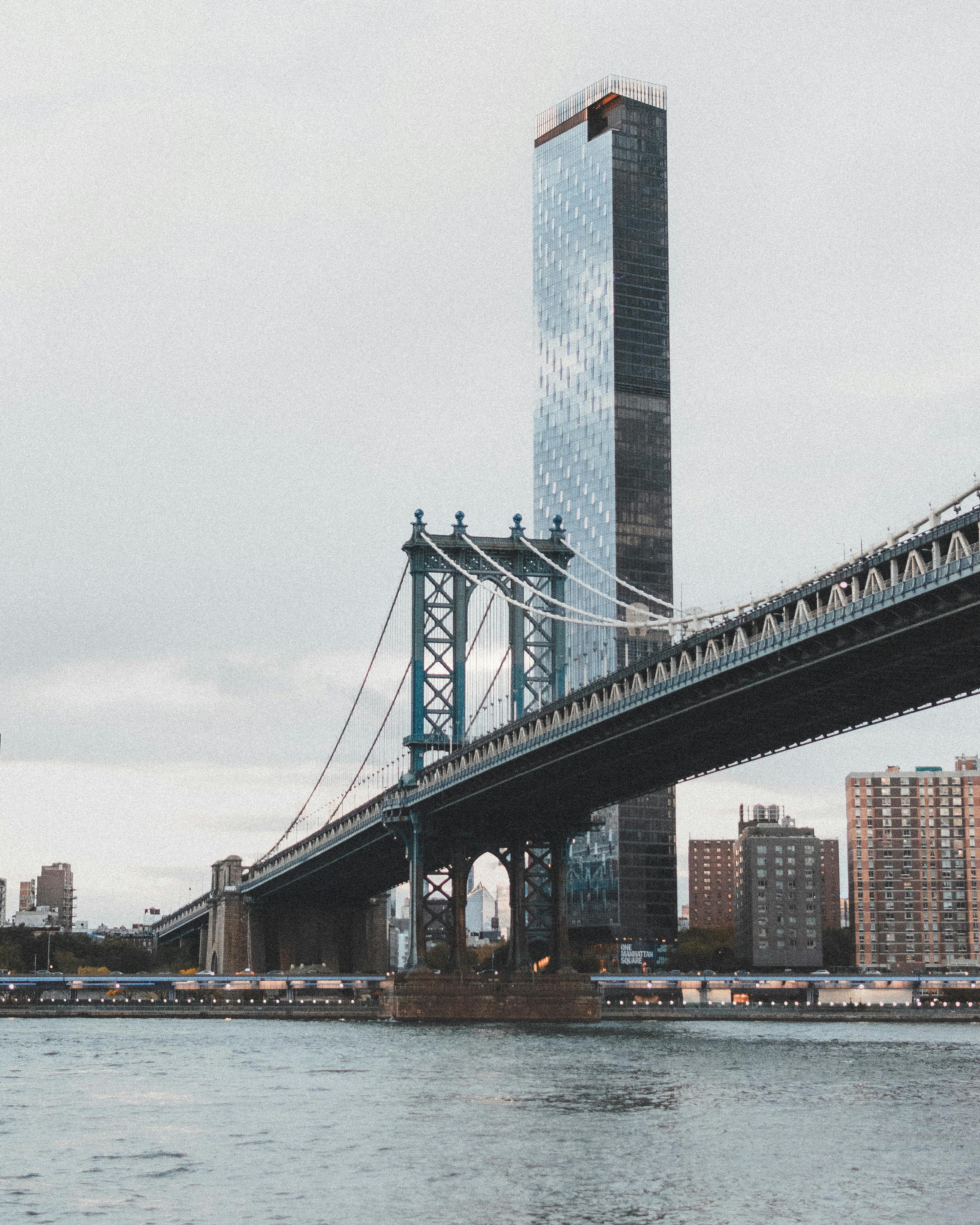 View of the Manhattan Bridge and One Manhattan Square Skyscraper in New ...