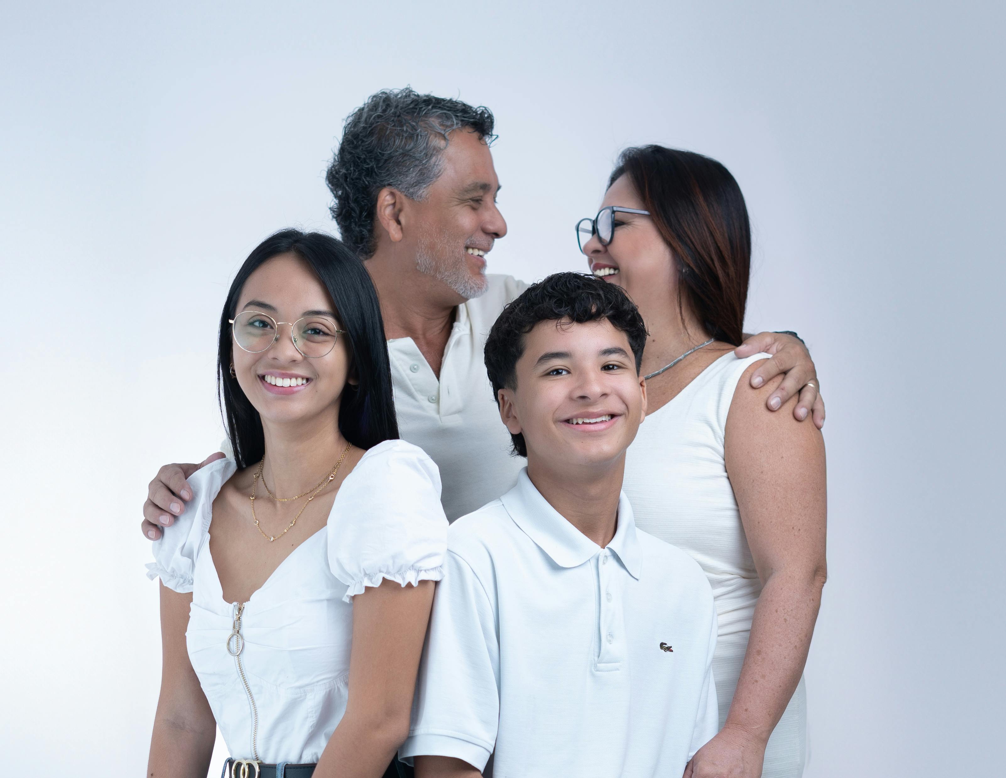 A Family Portrait of Parents with Son and Daughter · Free Stock Photo