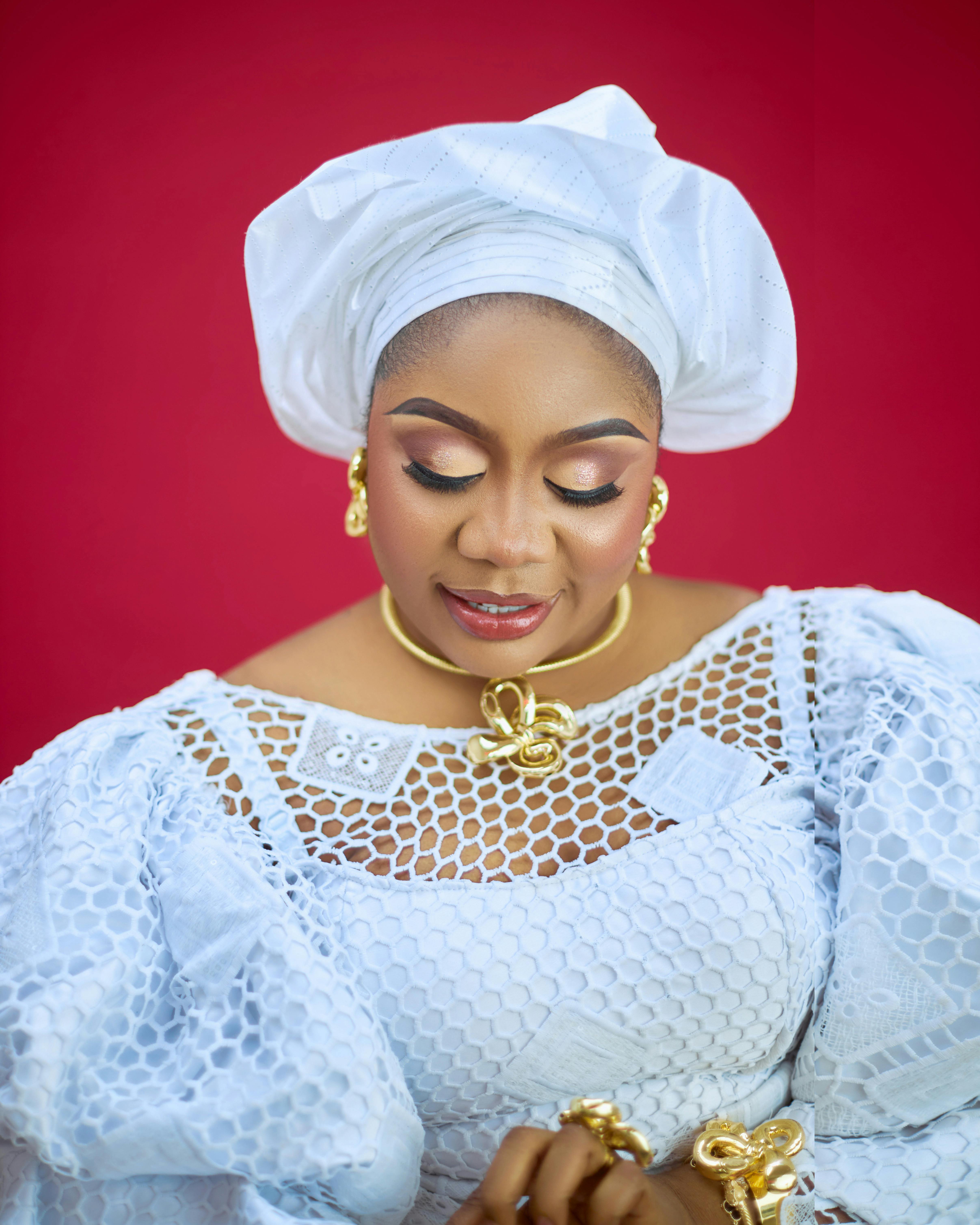 Black Woman in Traditional Clothing and Headwear on Red Background ...