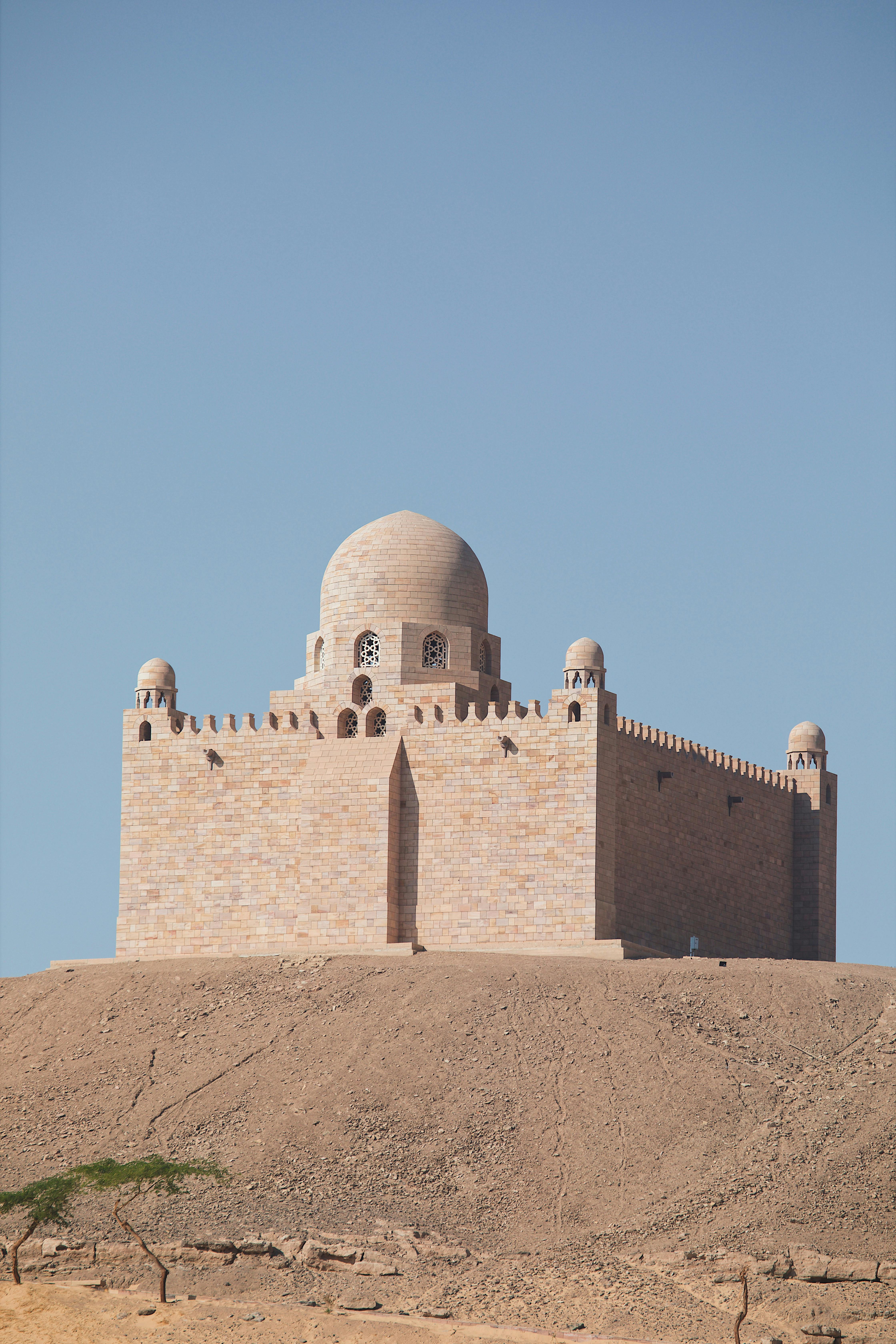 A large stone building with two domes on top of a hill · Free Stock Photo