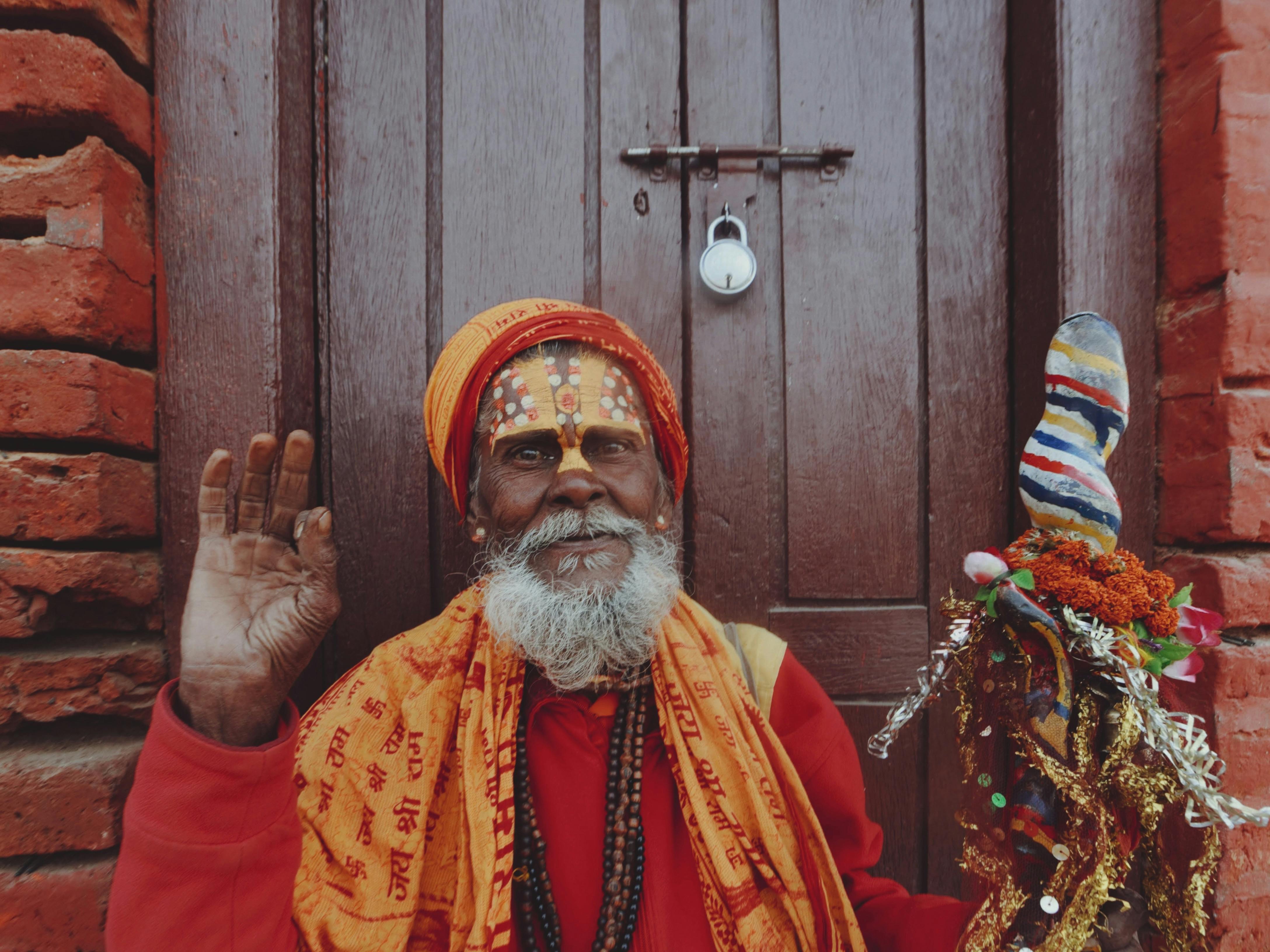 Smiling Sadhu by Wooden Door · Free Stock Photo