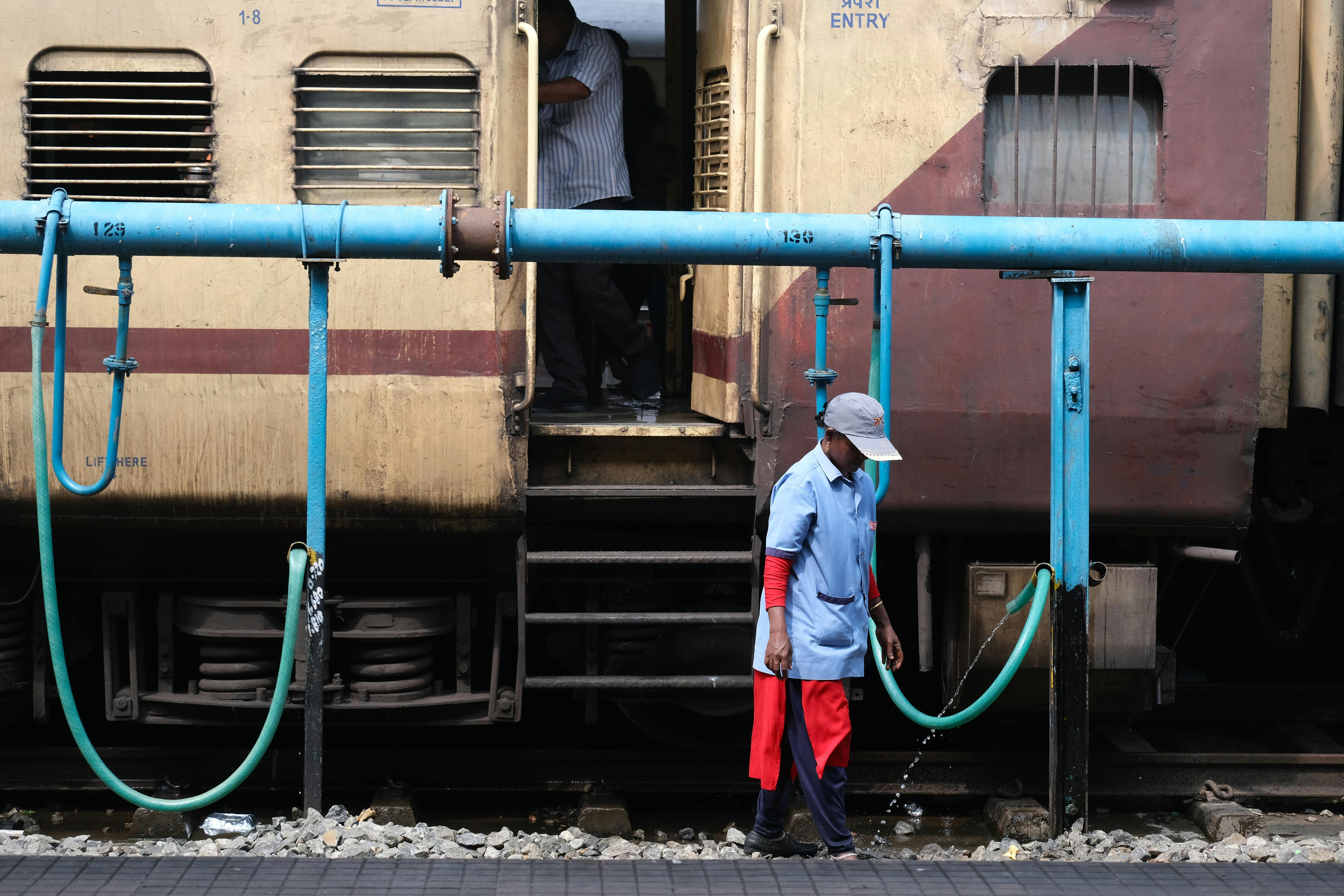 Worker Standing near Train · Free Stock Photo
