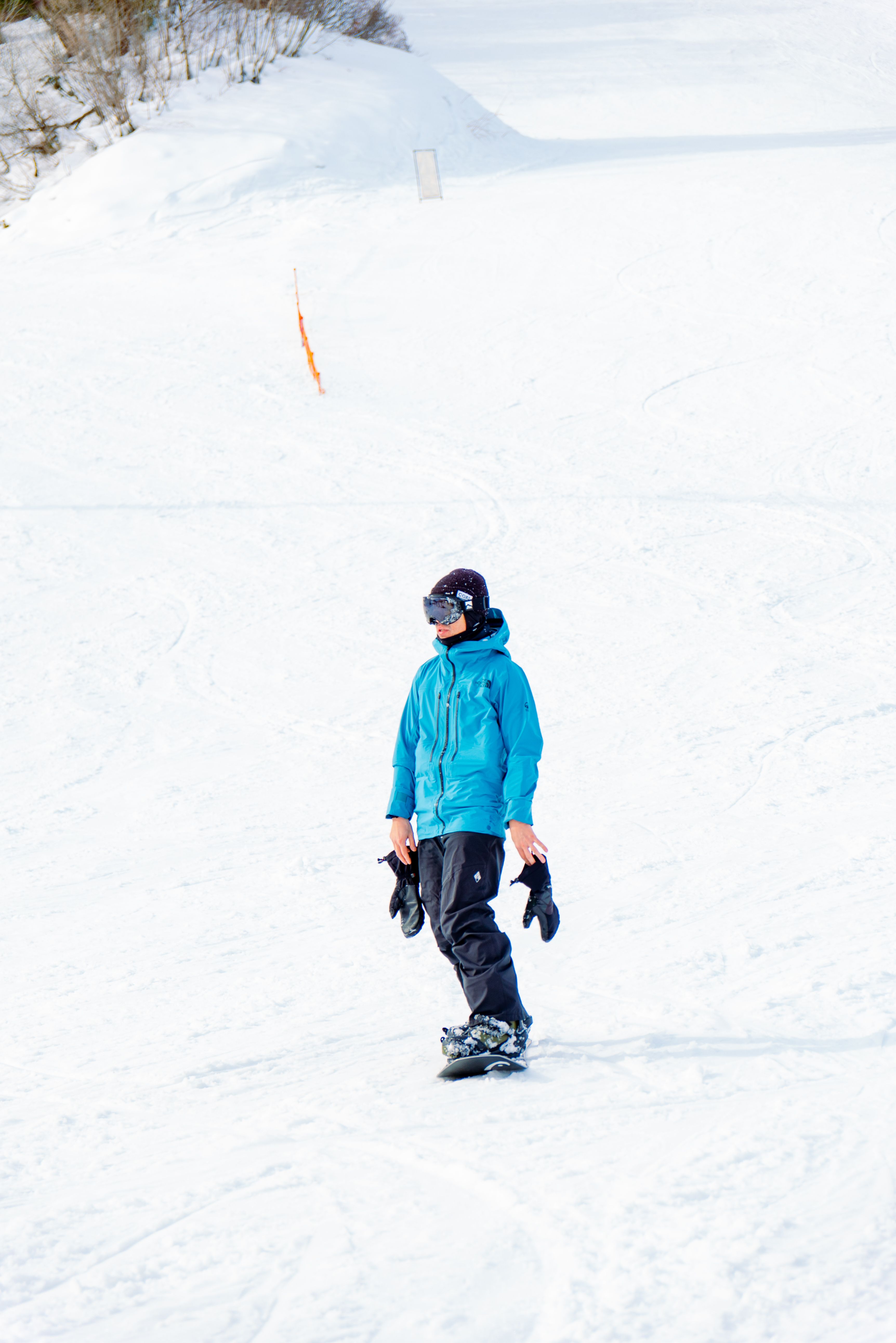 Person in Grey Hoodie Sitting on Snowboard · Free Stock Photo