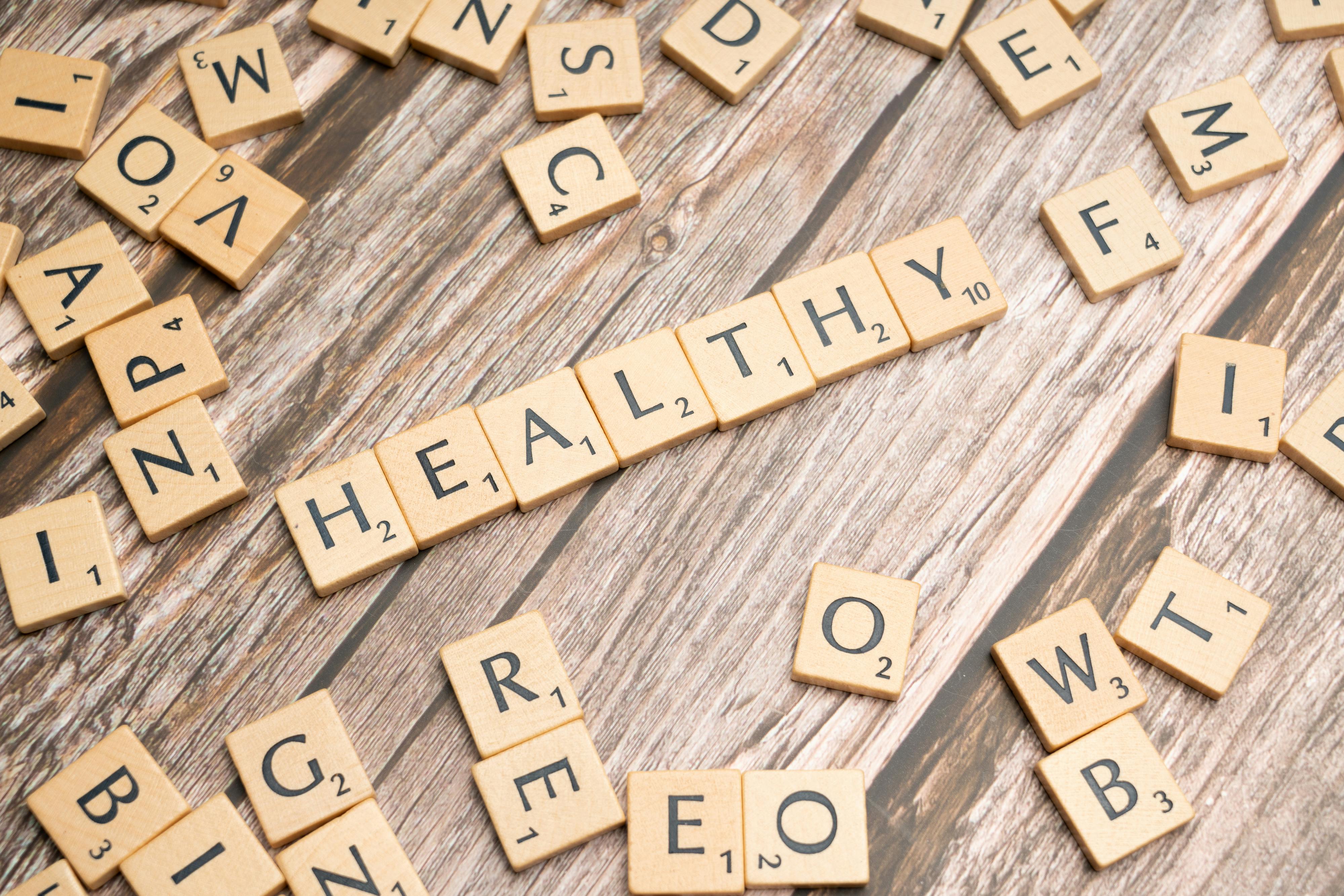 The word healthy spelled out in scrabble letters · Free Stock Photo