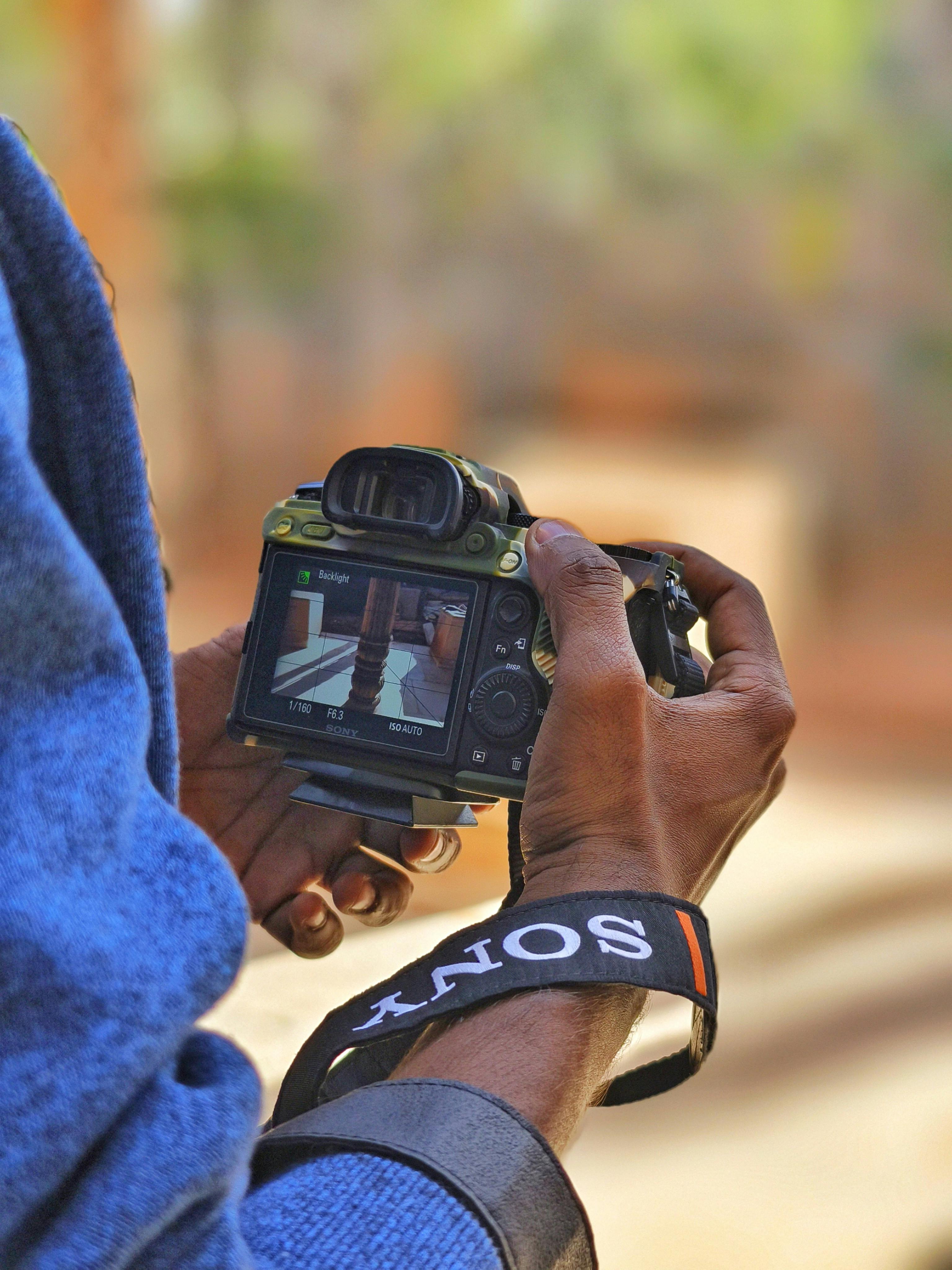 Sony Camera in Hands · Free Stock Photo