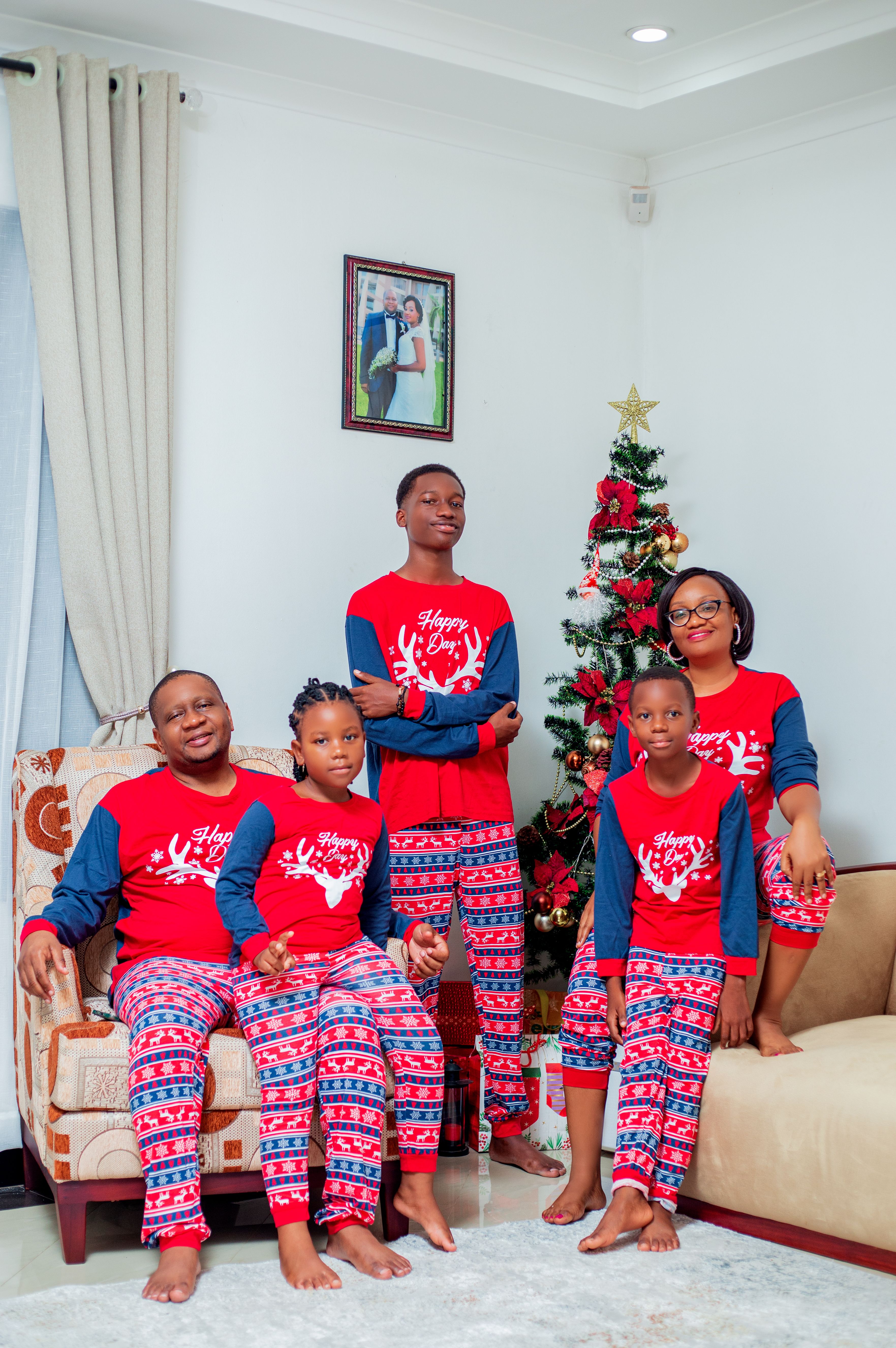 Happy Family in Christmas Pyjamas Posing Together in Living Room · Free ...