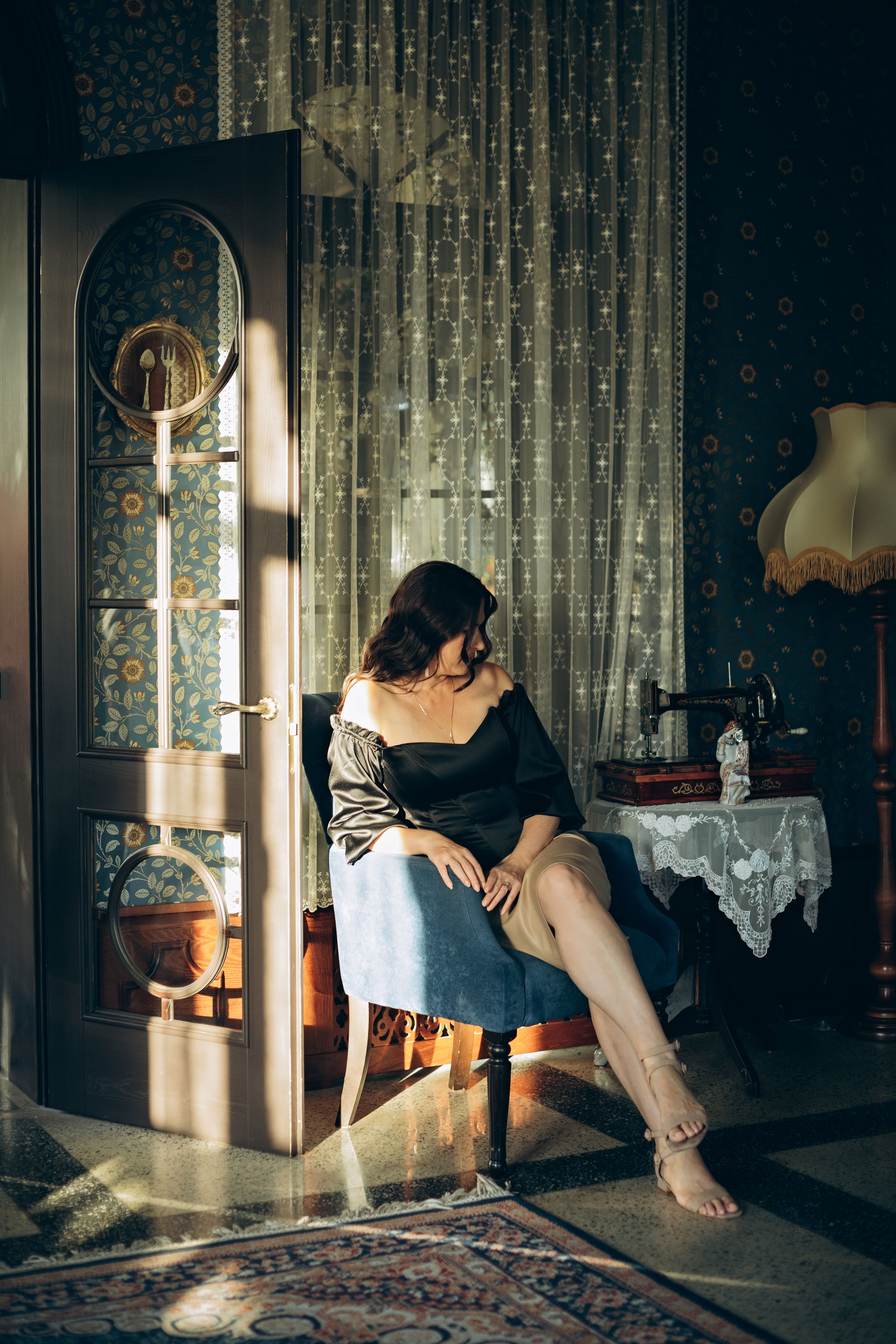 Woman Sitting in a Retro Living Room · Free Stock Photo