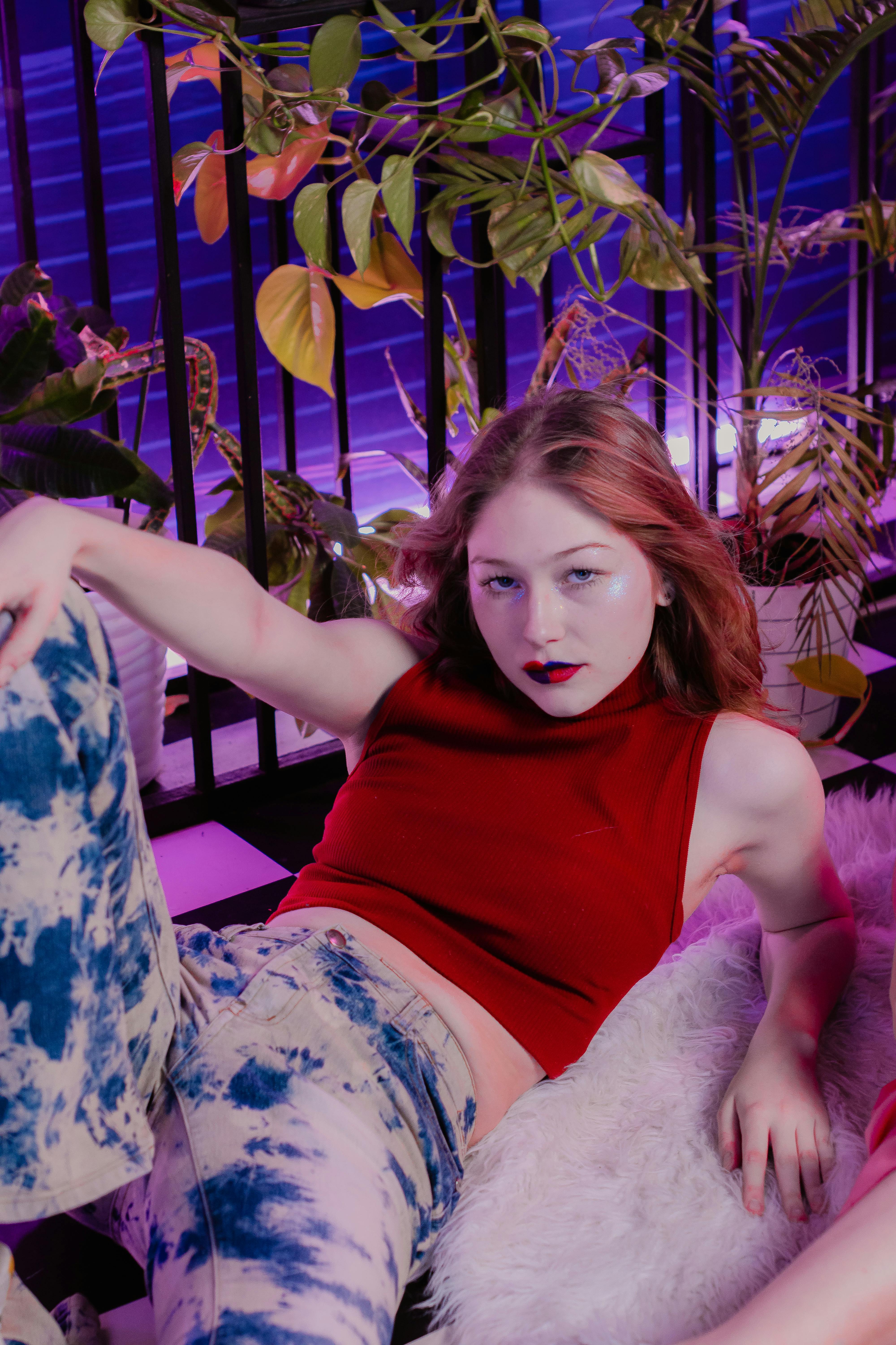 Woman Lying Down in Red Top · Free Stock Photo