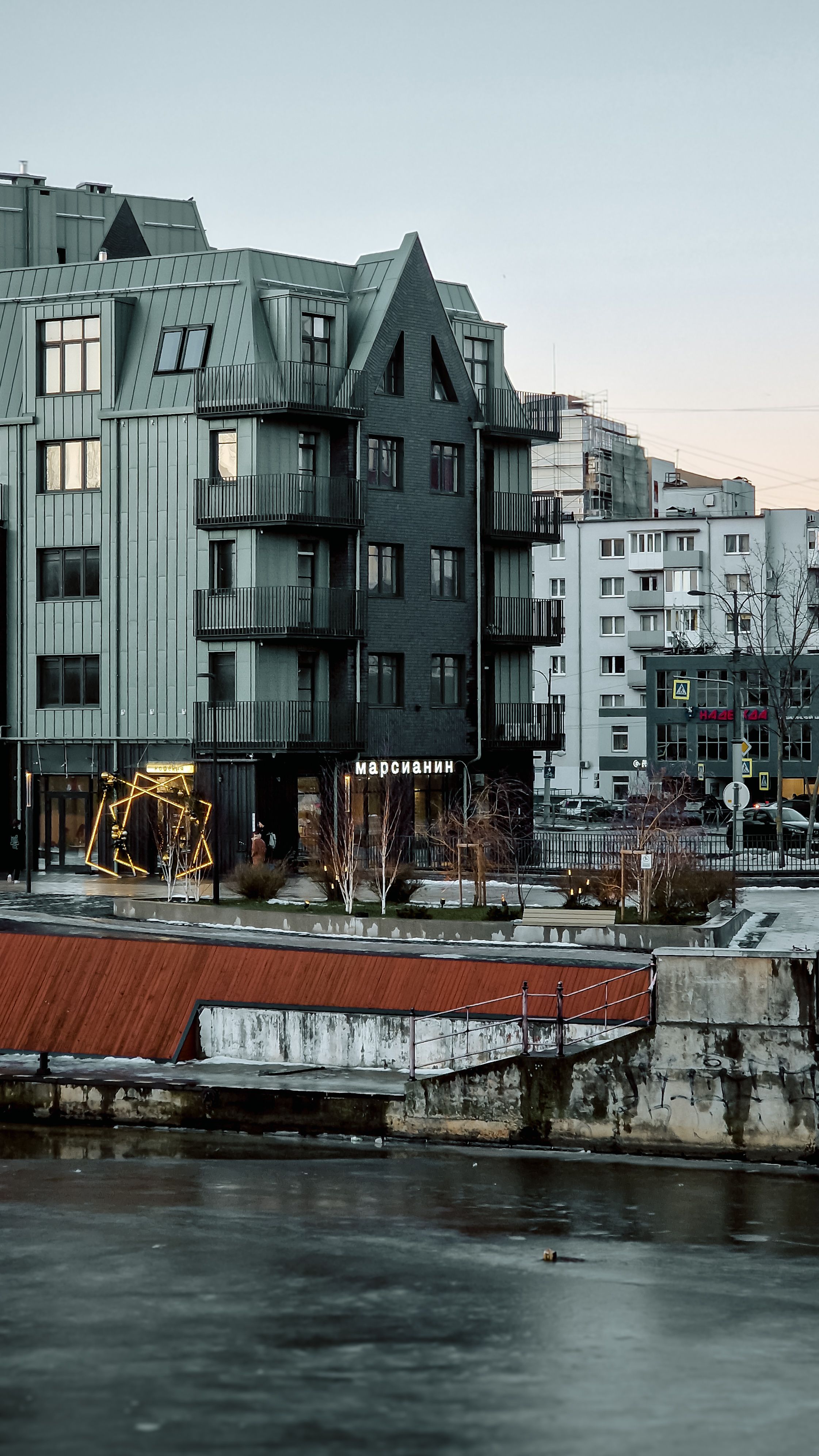 Residential Building near River in City · Free Stock Photo