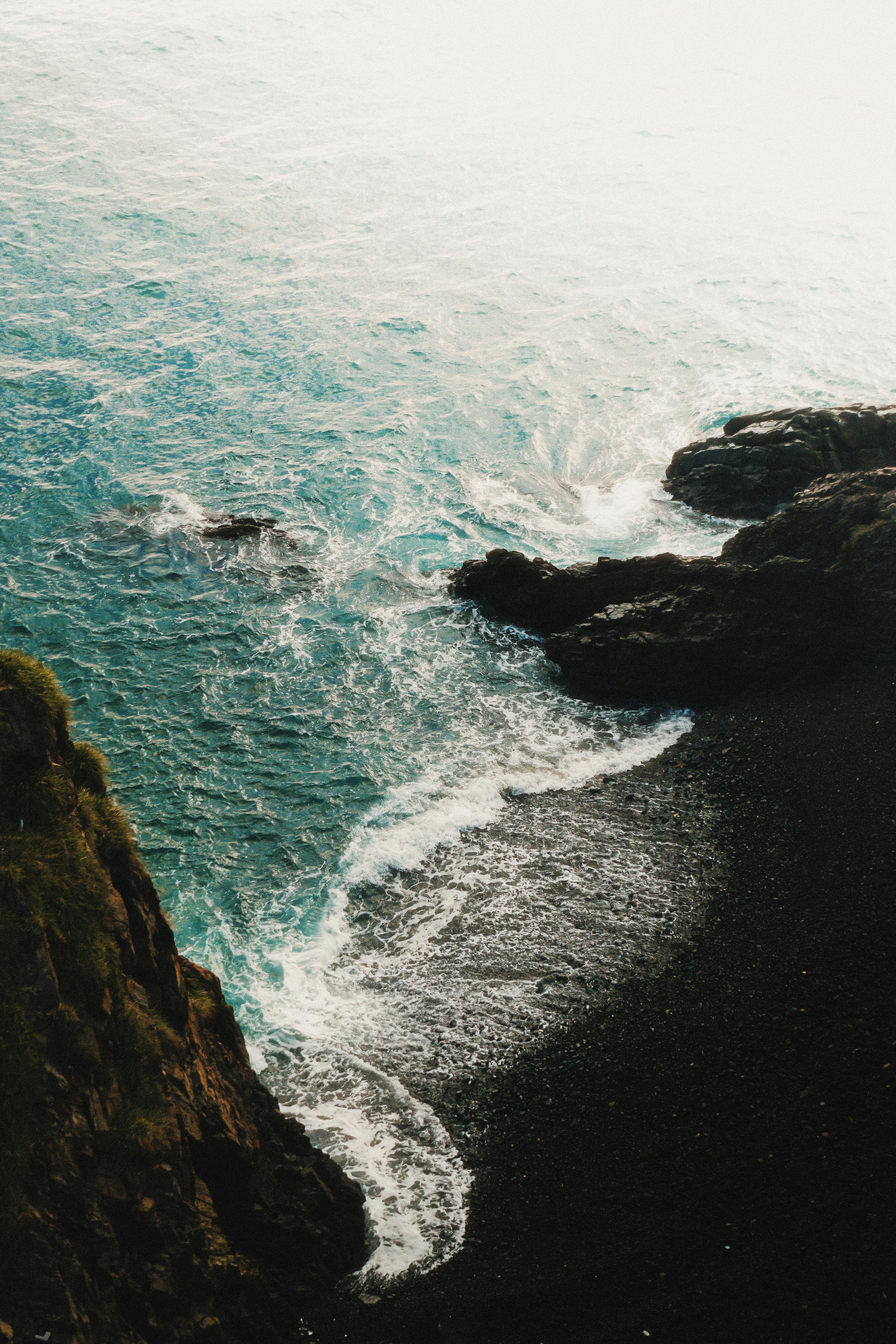 Cliff over Beach on Sea Shore · Free Stock Photo