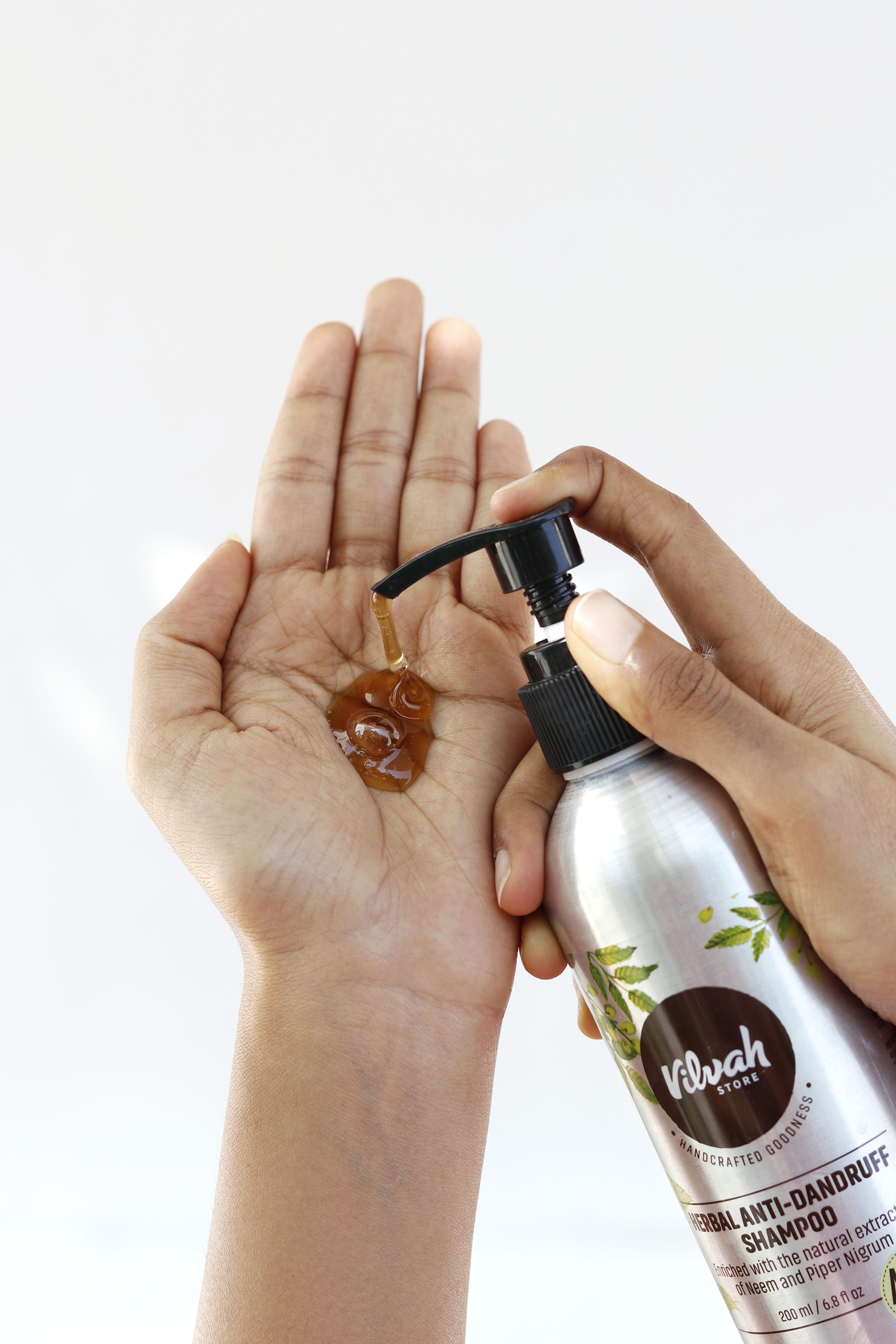 Close-up of Person Squeezing Shampoo in Palm · Free Stock Photo