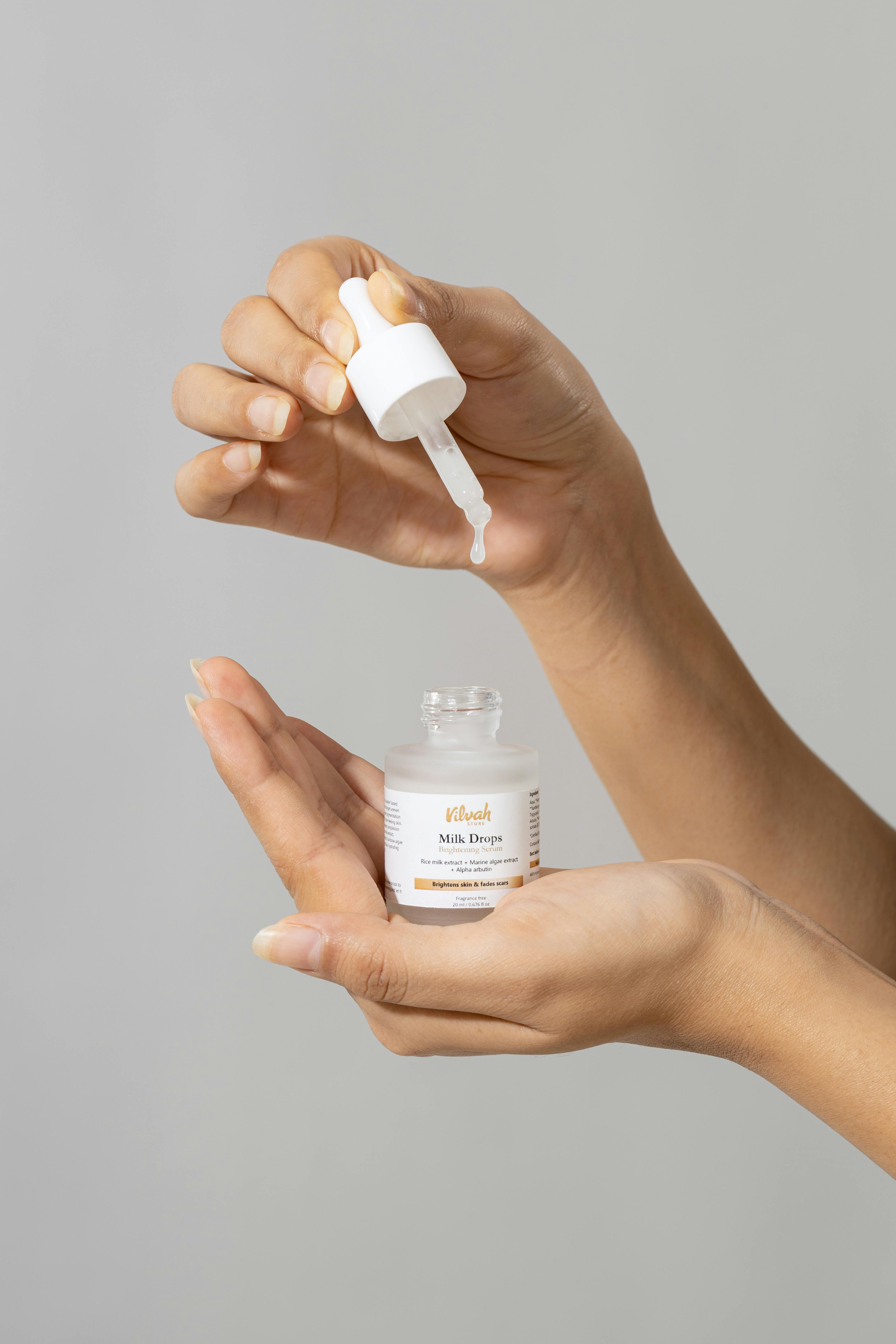 Person Holding A Glass Dropper · Free Stock Photo