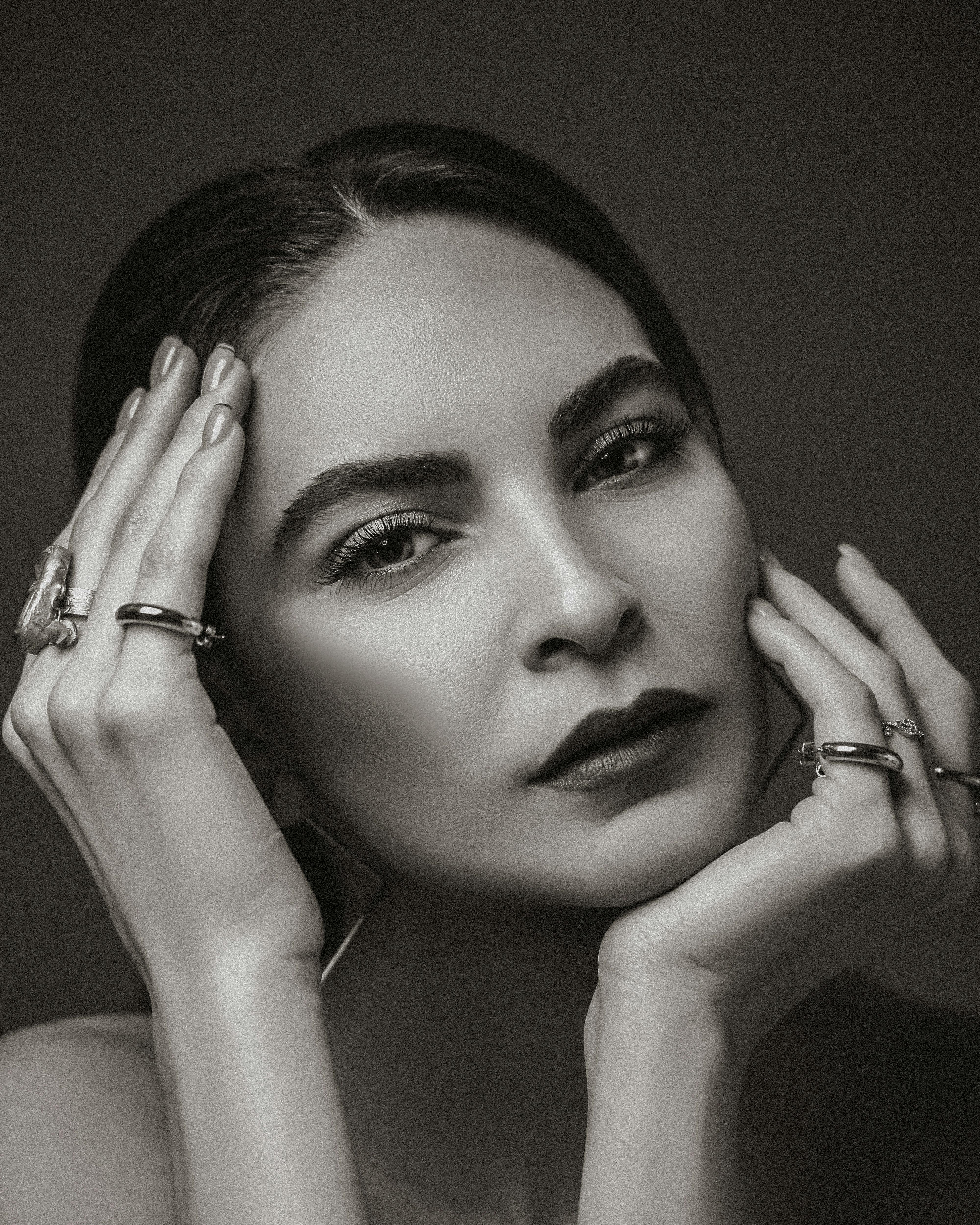 Woman with Hands around Face in Black and White · Free Stock Photo