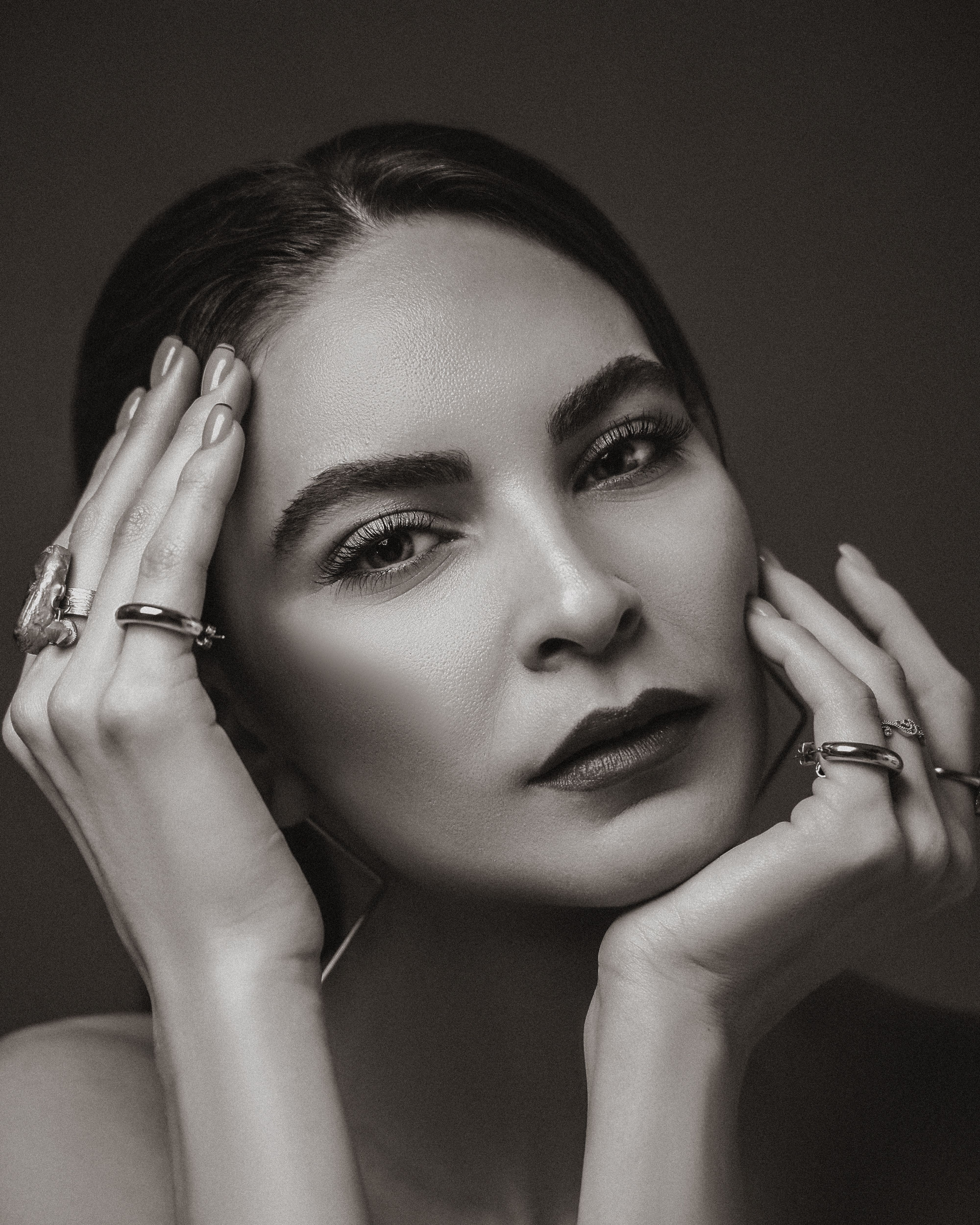 Woman with Hands around Face in Black and White · Free Stock Photo