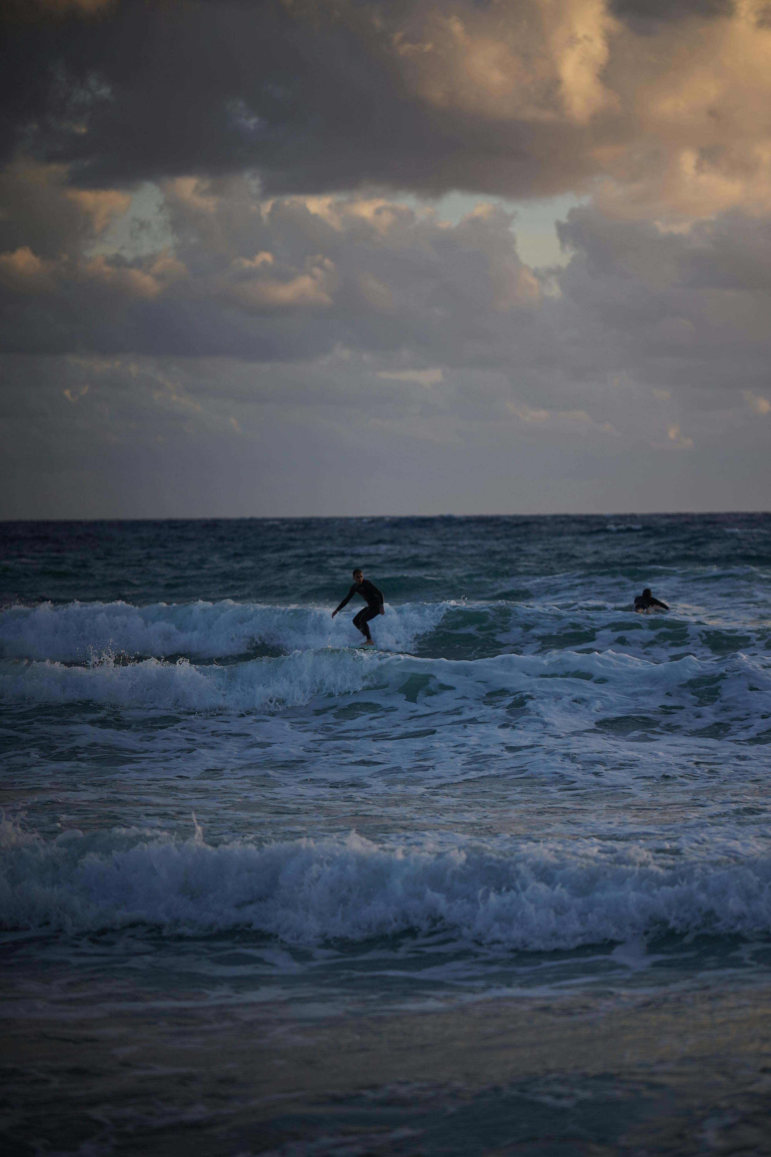 Surfer on Waves on Shore · Free Stock Photo