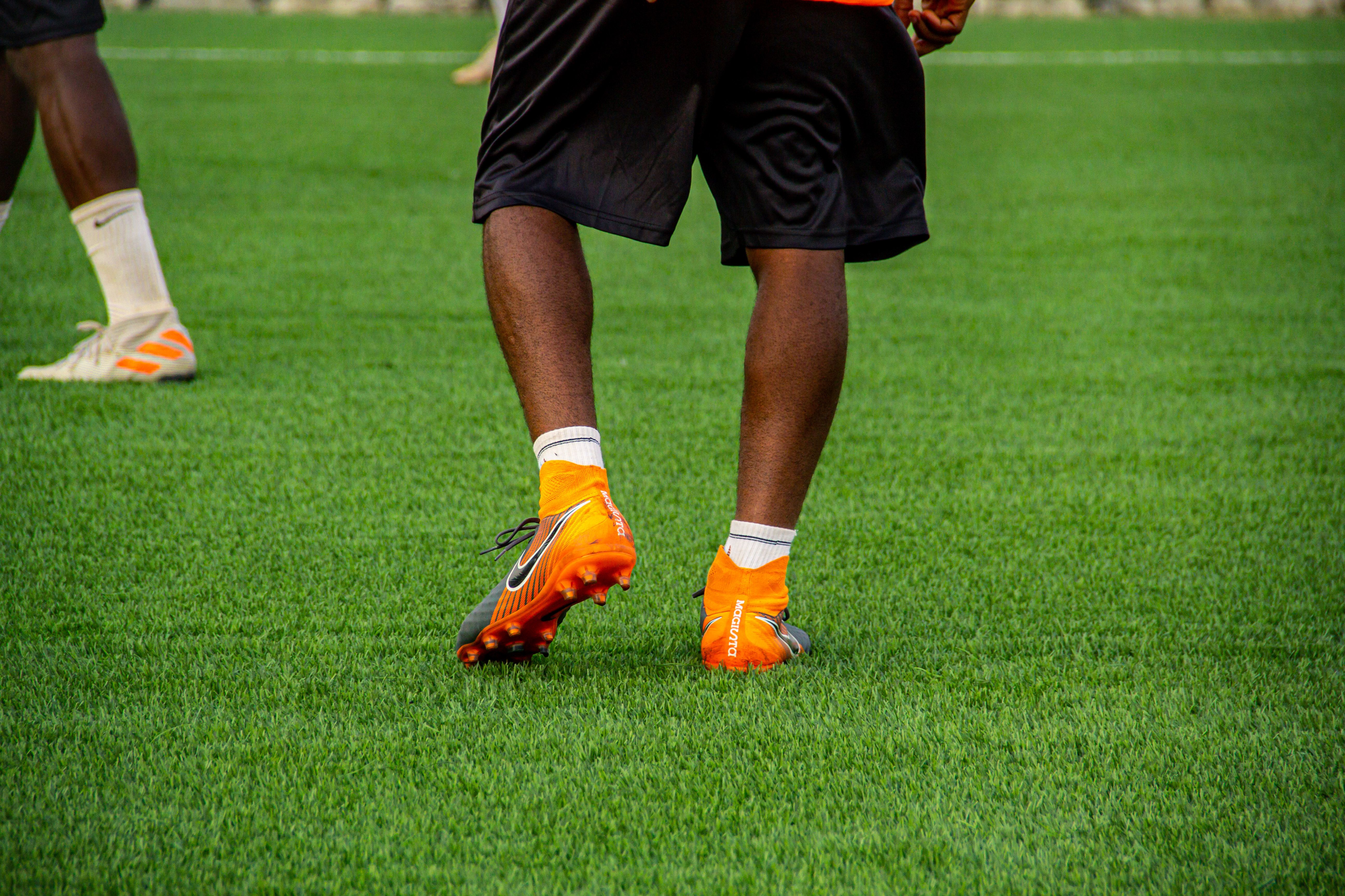 Black Players on Football Field · Free Stock Photo