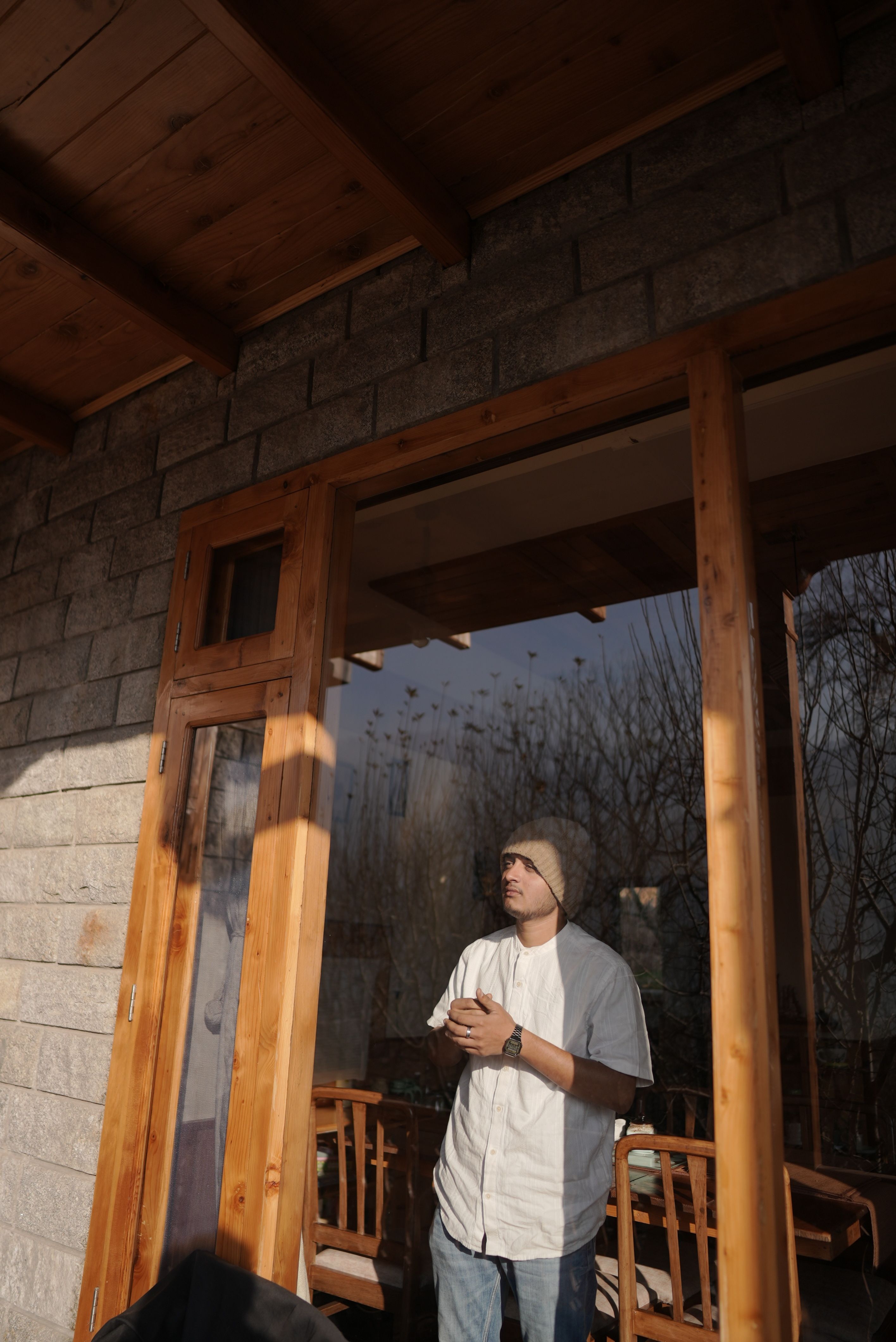Man in Hat Standing behind Window · Free Stock Photo