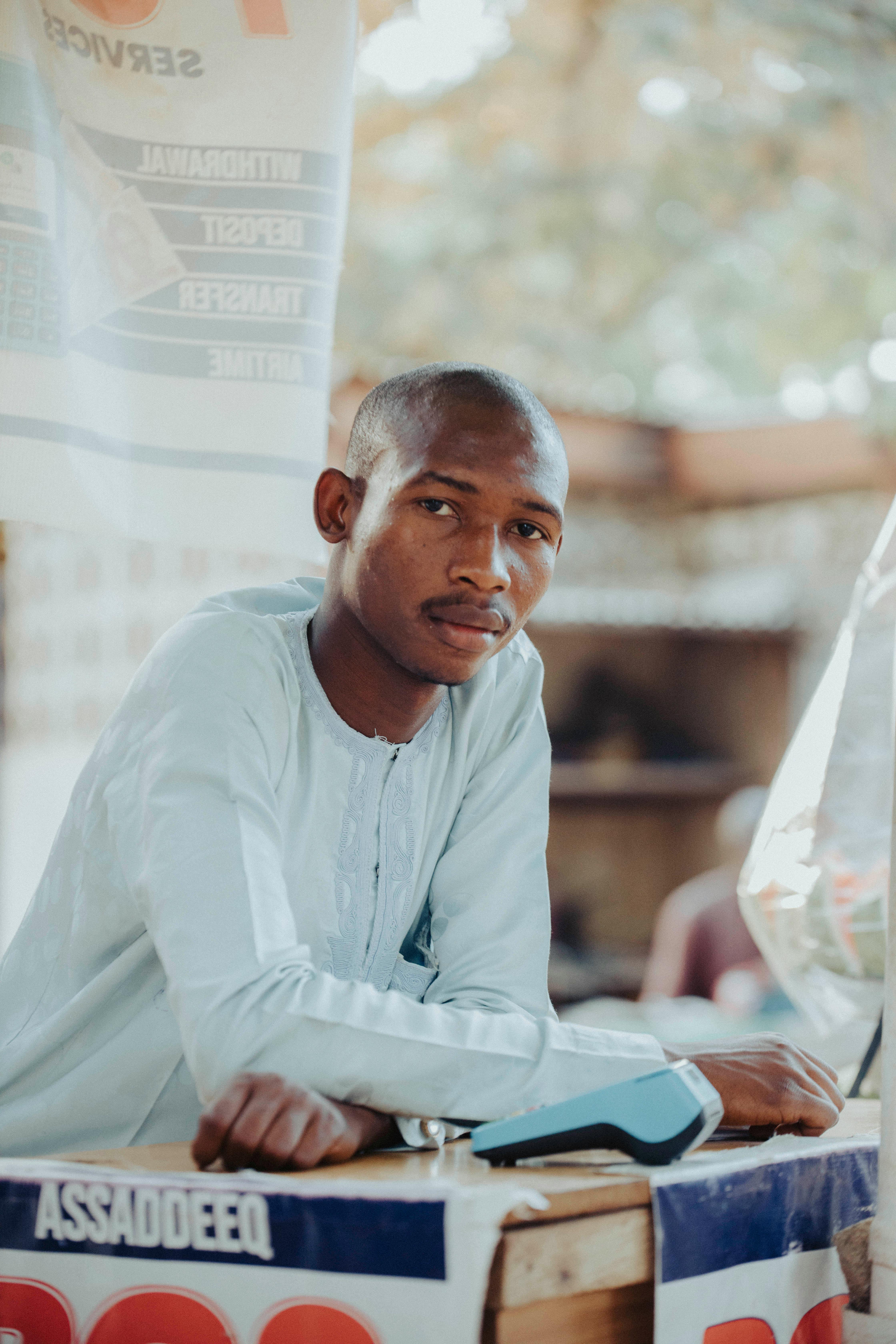Man Leaning on Desk · Free Stock Photo