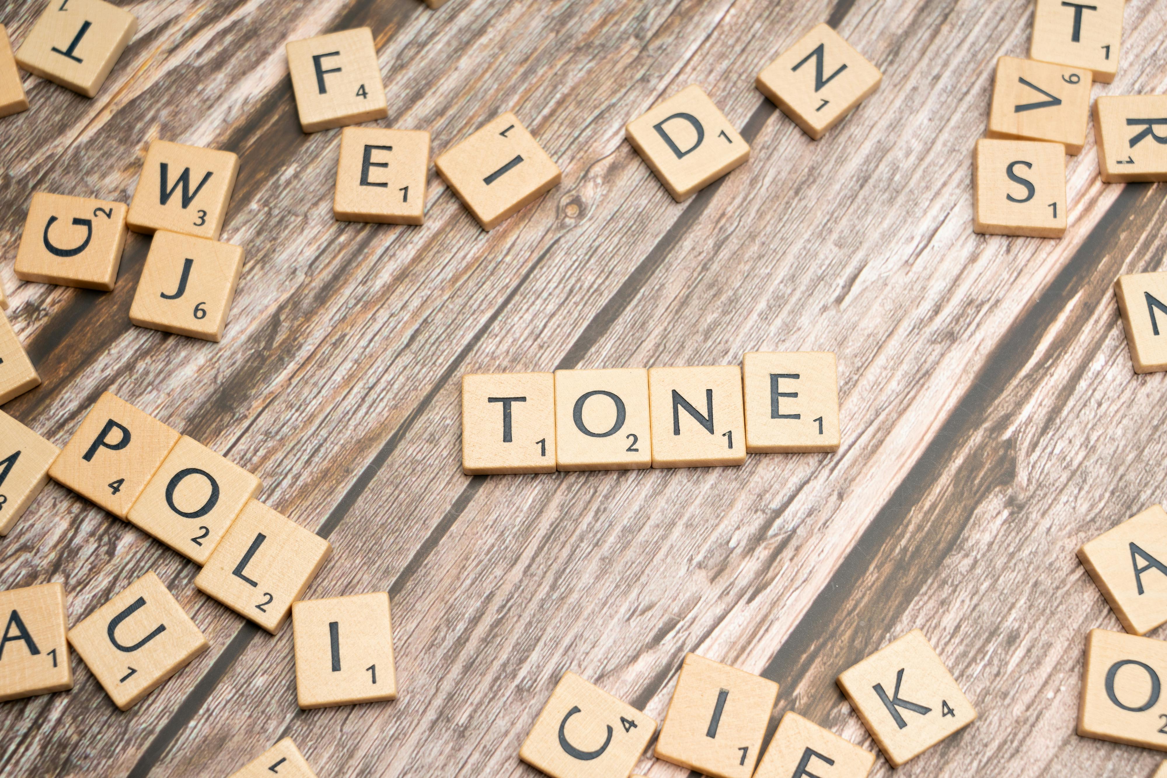 The word tone is spelled out in scrabble letters · Free Stock Photo