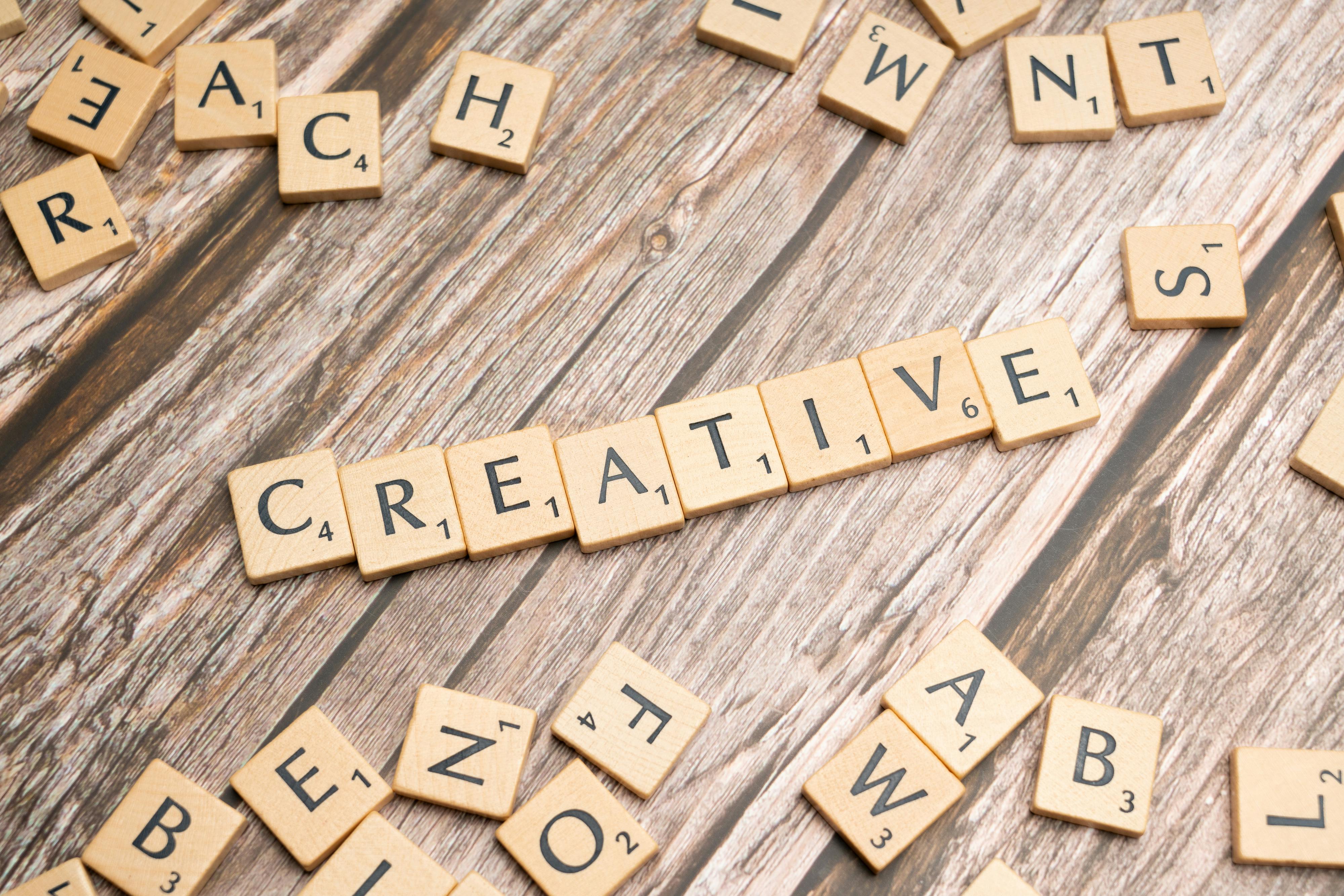 The word creative spelled out in scrabble letters · Free Stock Photo