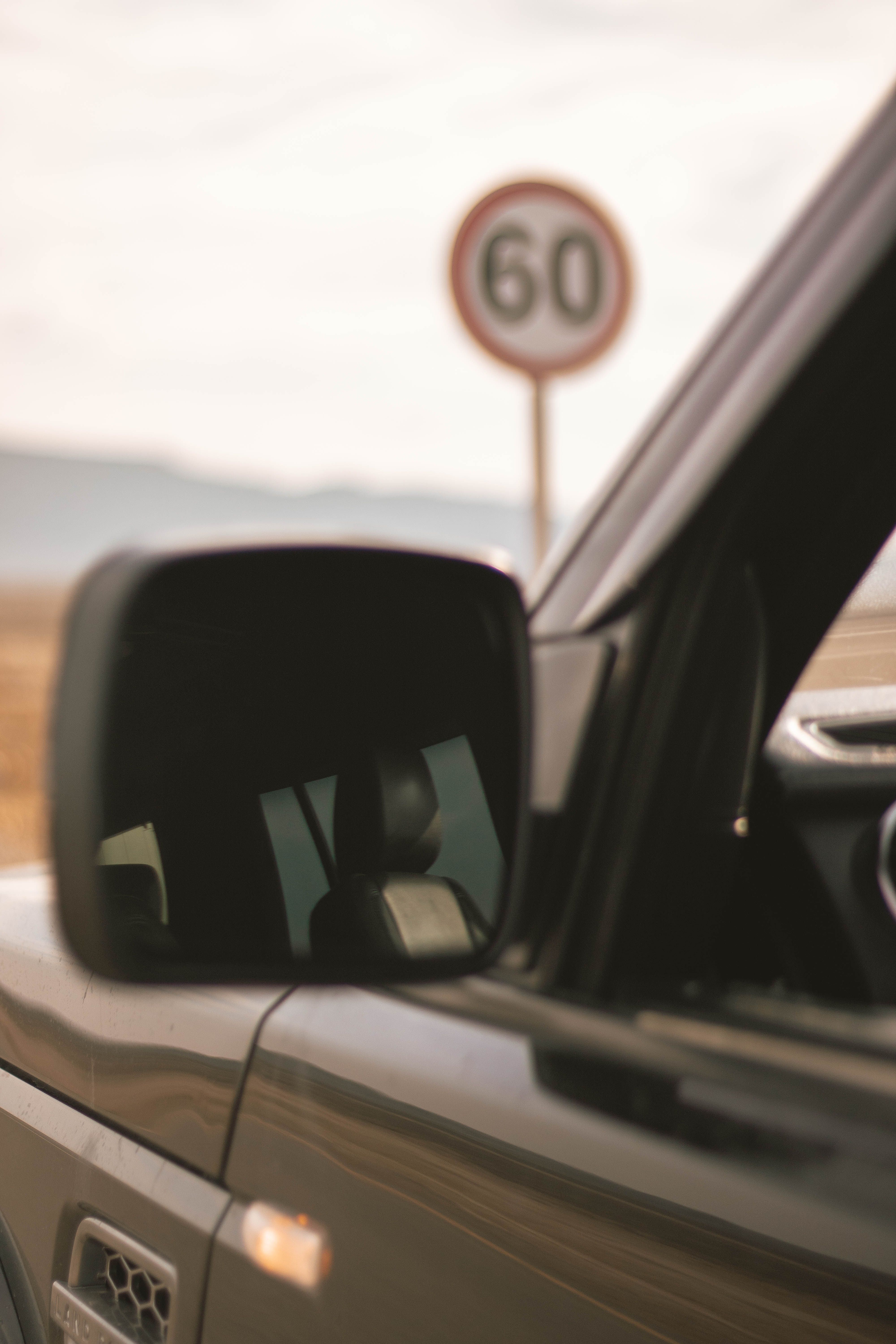 Reflection in Car Mirror · Free Stock Photo