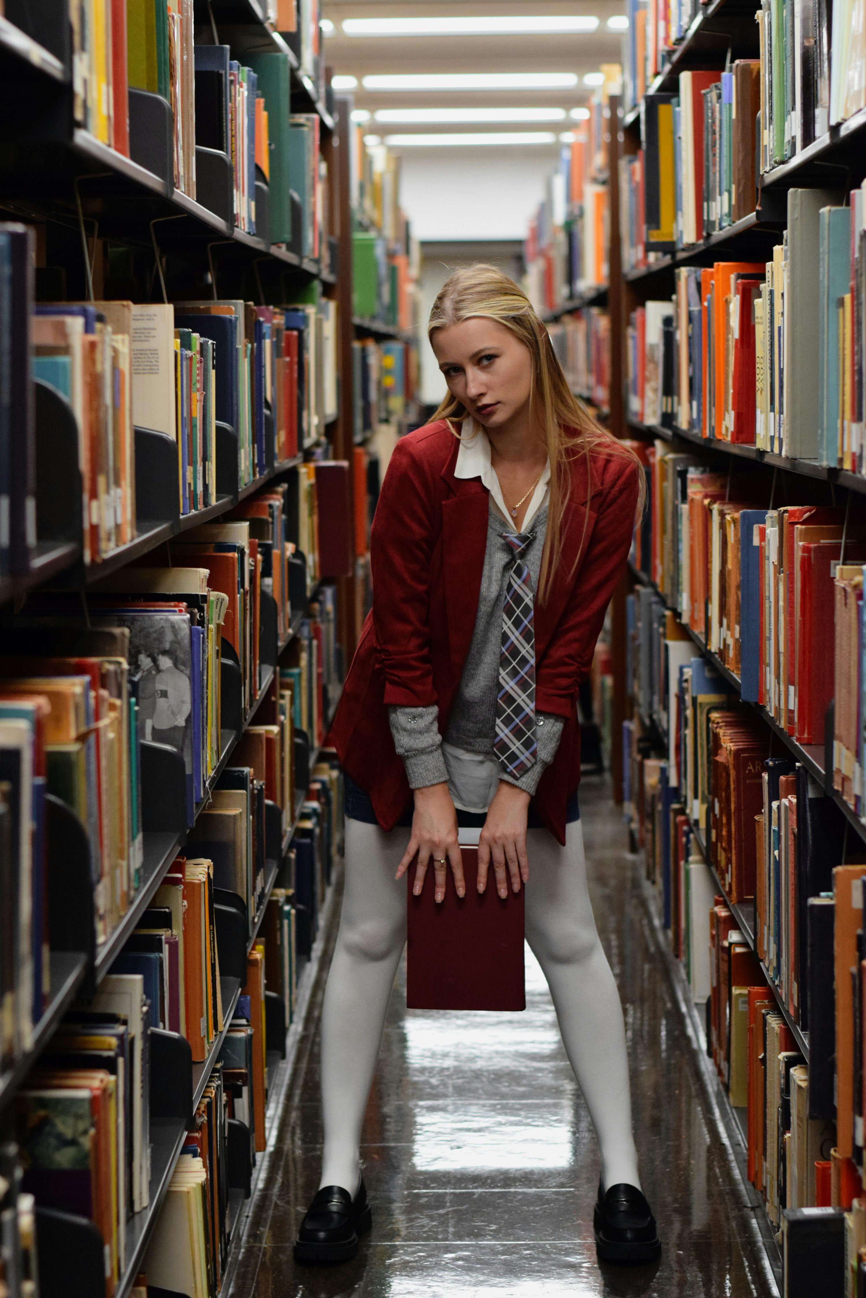 Blonde Woman Posing at Library · Free Stock Photo