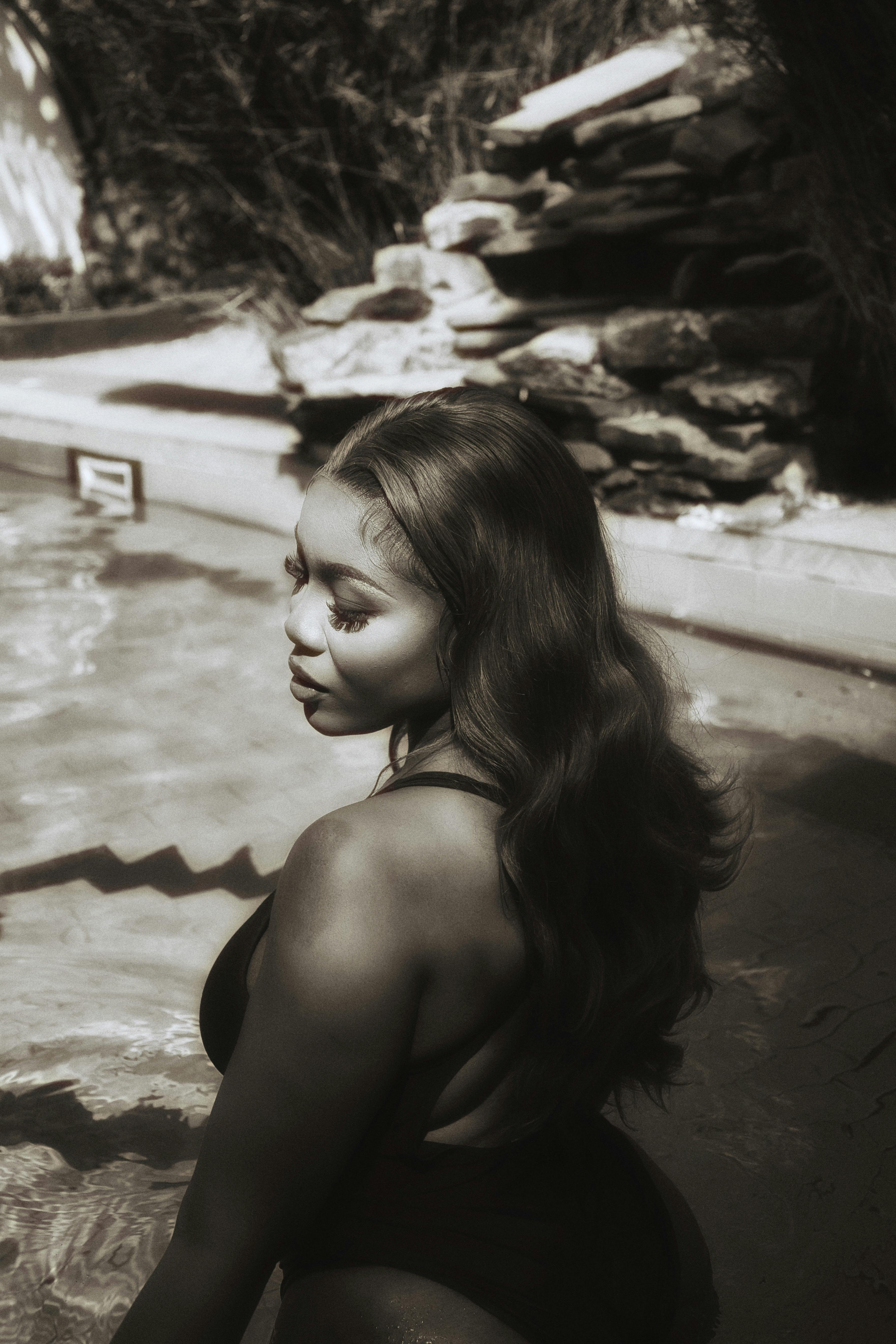 Back View of Woman Standing in Swimming Pool · Free Stock Photo