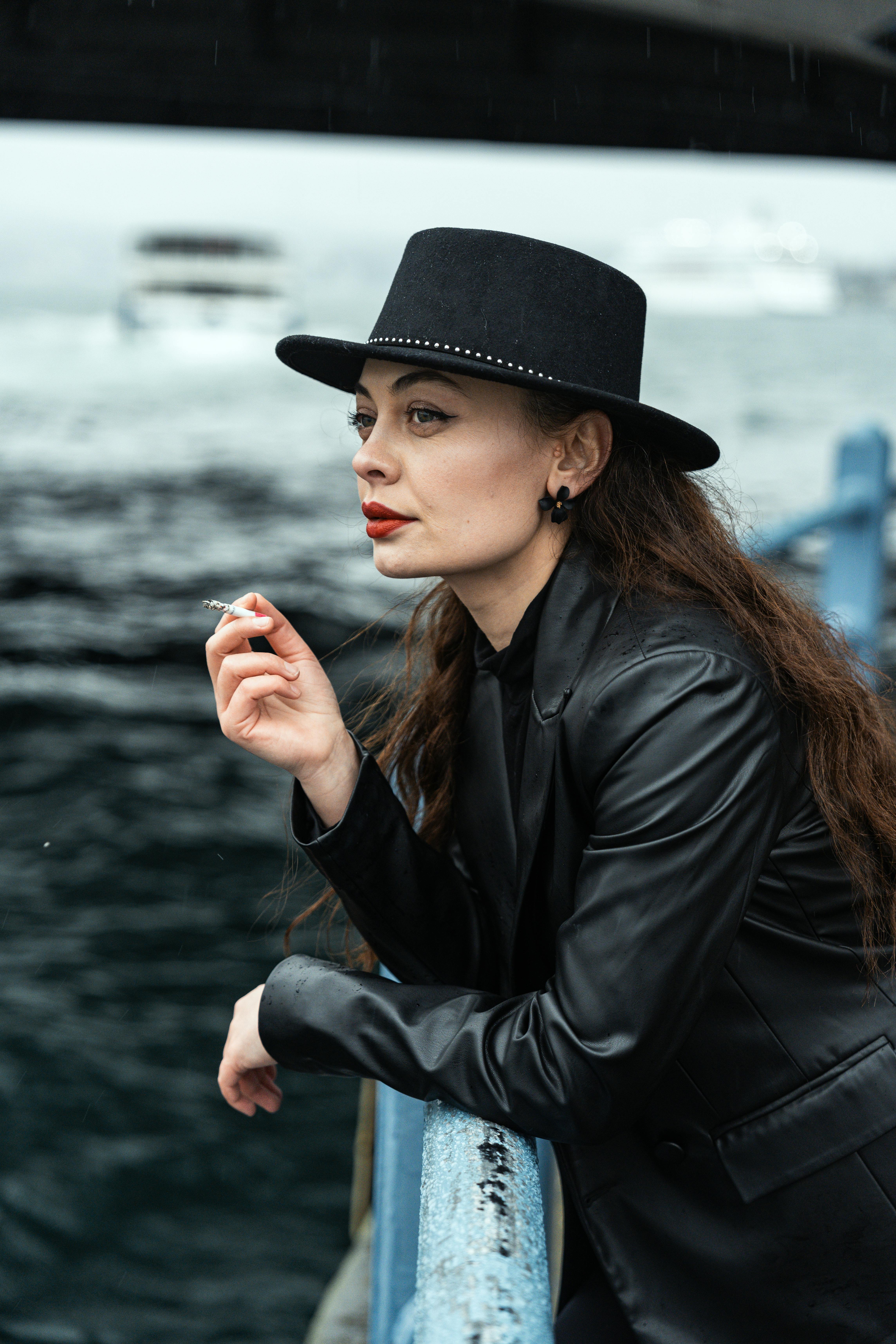 Pretty Woman in Leather Jacker Smoking Cigarette by River · Free Stock ...