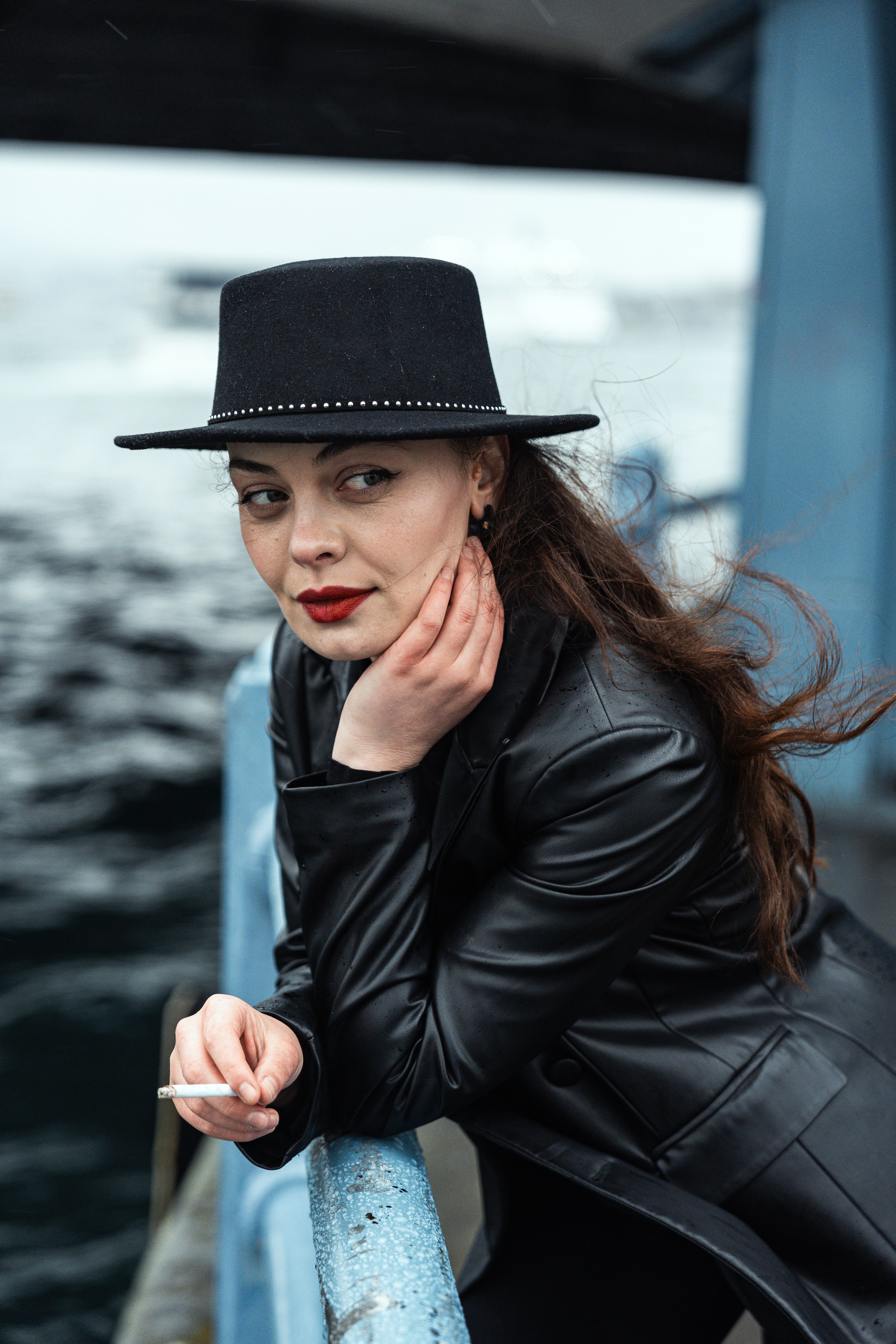 Brunette Woman in Leather Jacket Smoking Cigarette · Free Stock Photo